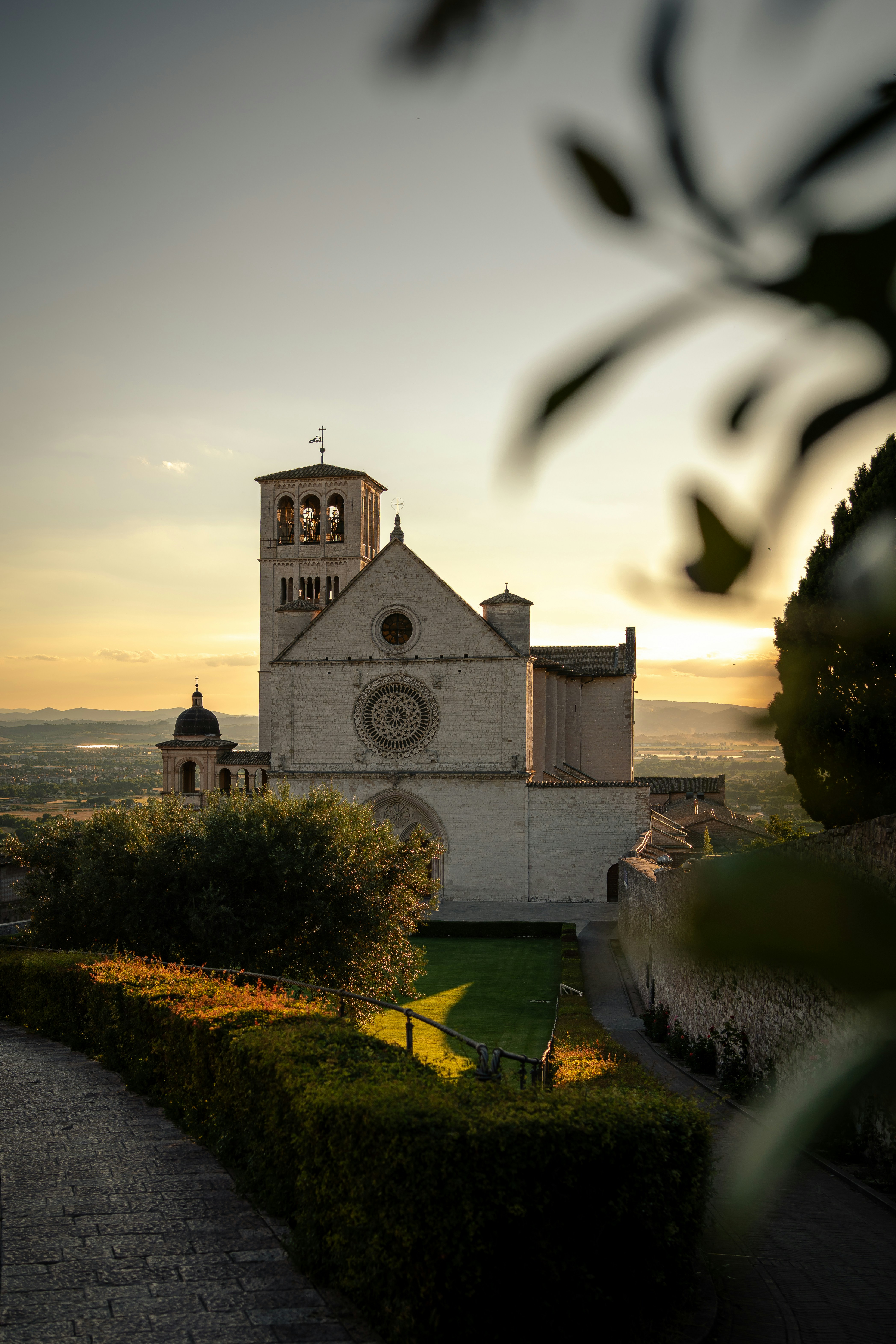 Sunlit Abbey in Focus: A Quiet Climb to the Hilltop Church