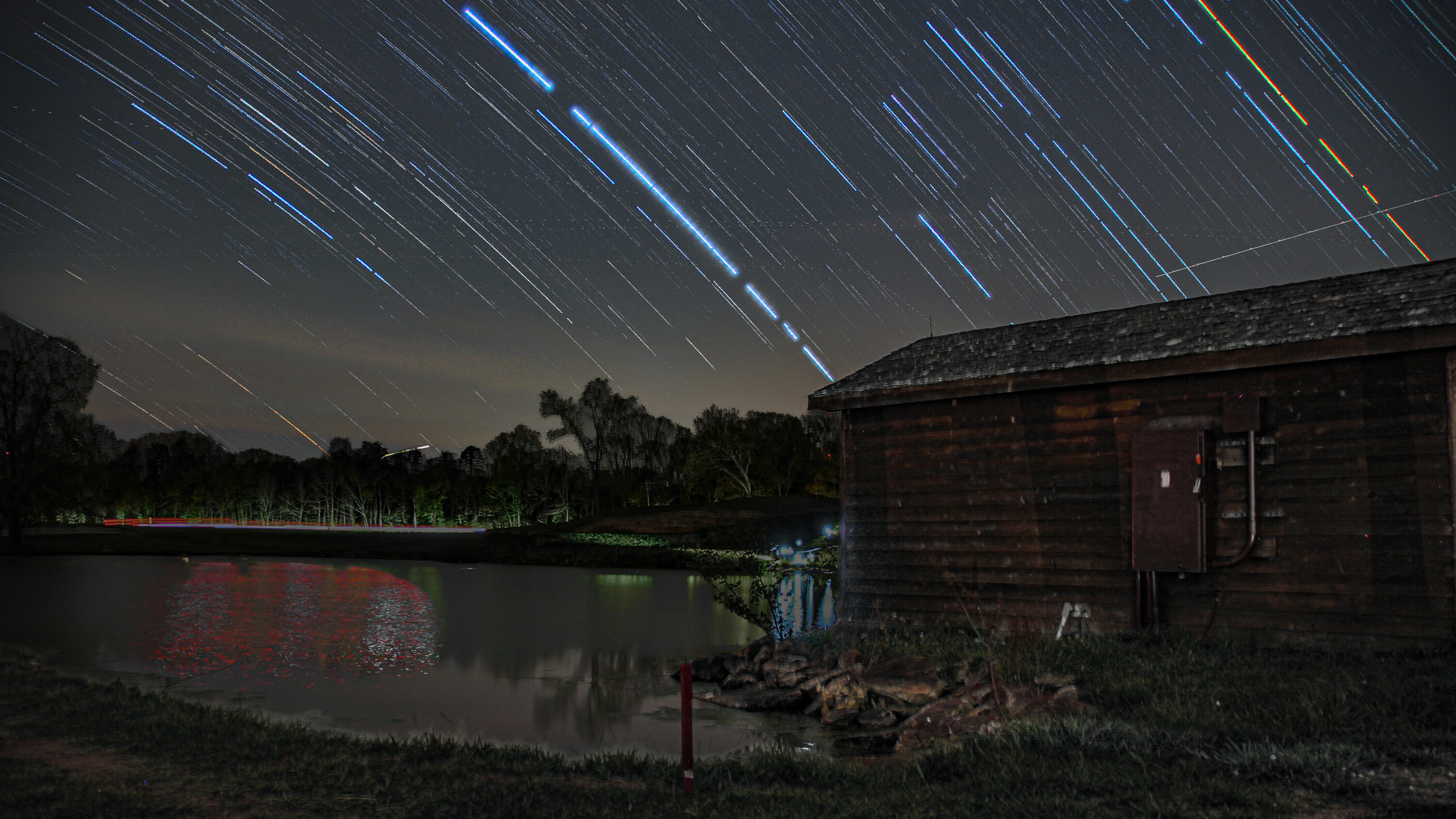 Star Trails Over a Quiet Lakeside Barn