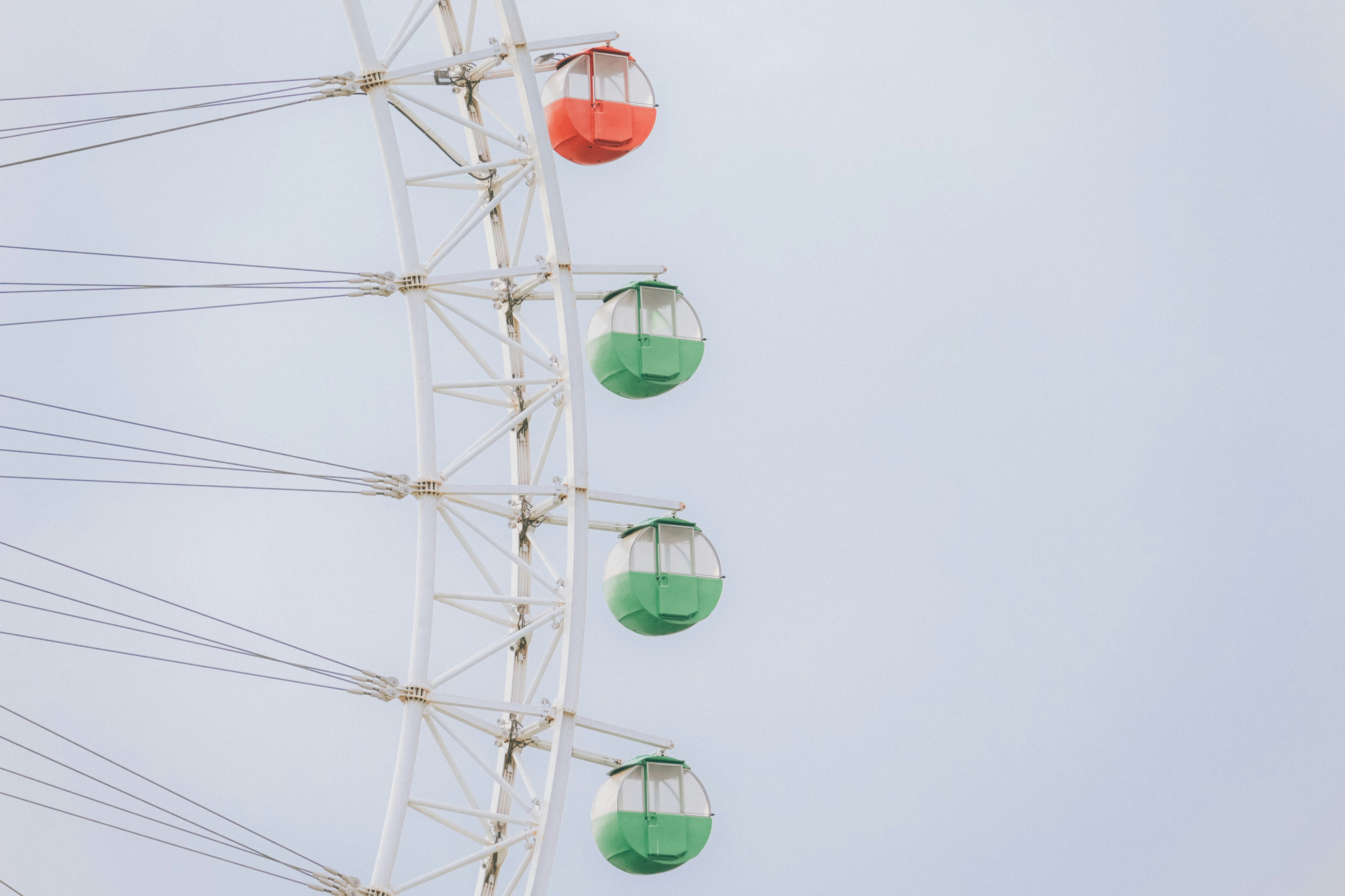 Pastel Sky and Circular Carriage: A Ferris Wheel Tale