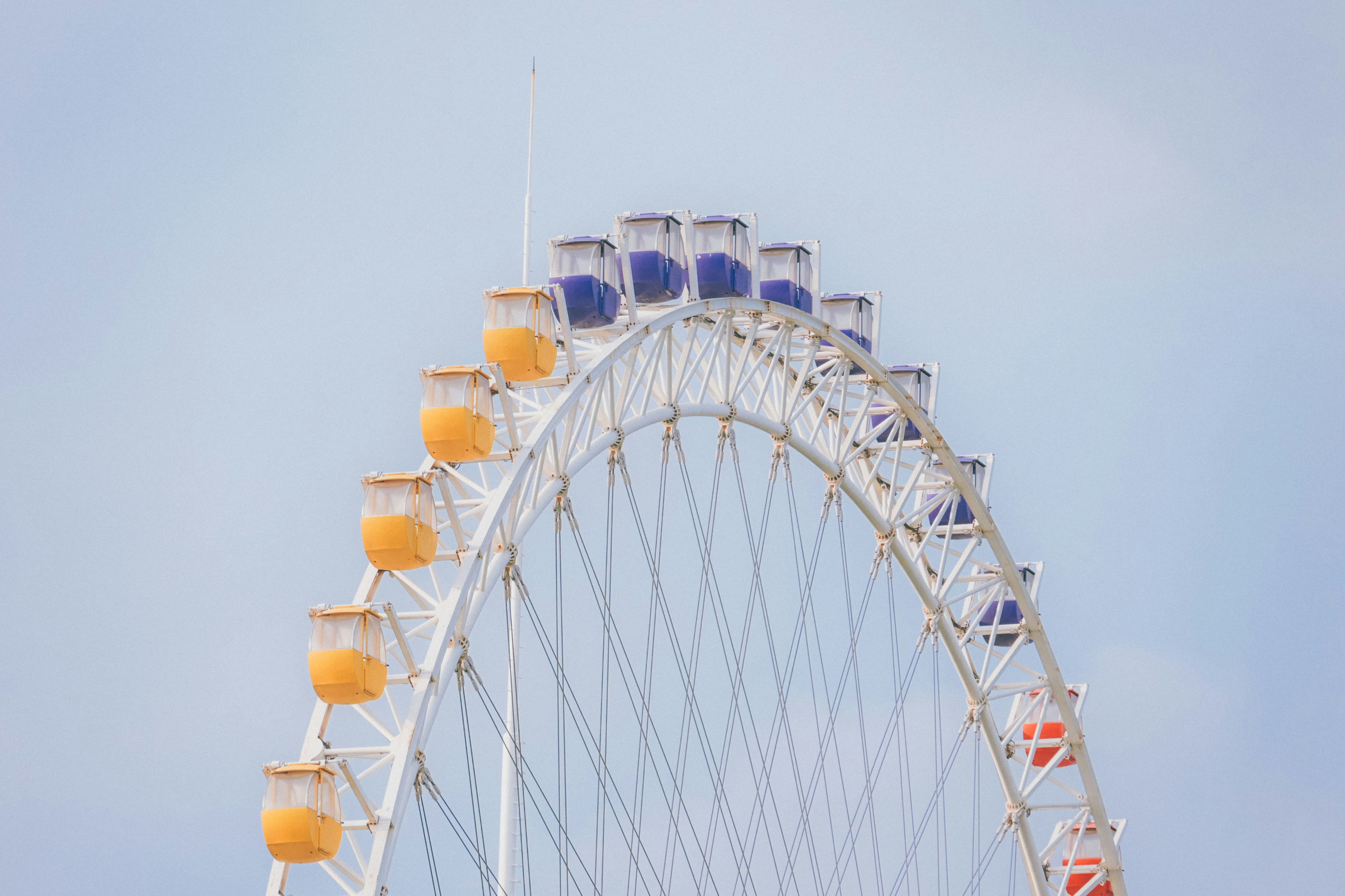 Pastel Ferris Wheel Cutaway Above a Calm Sky