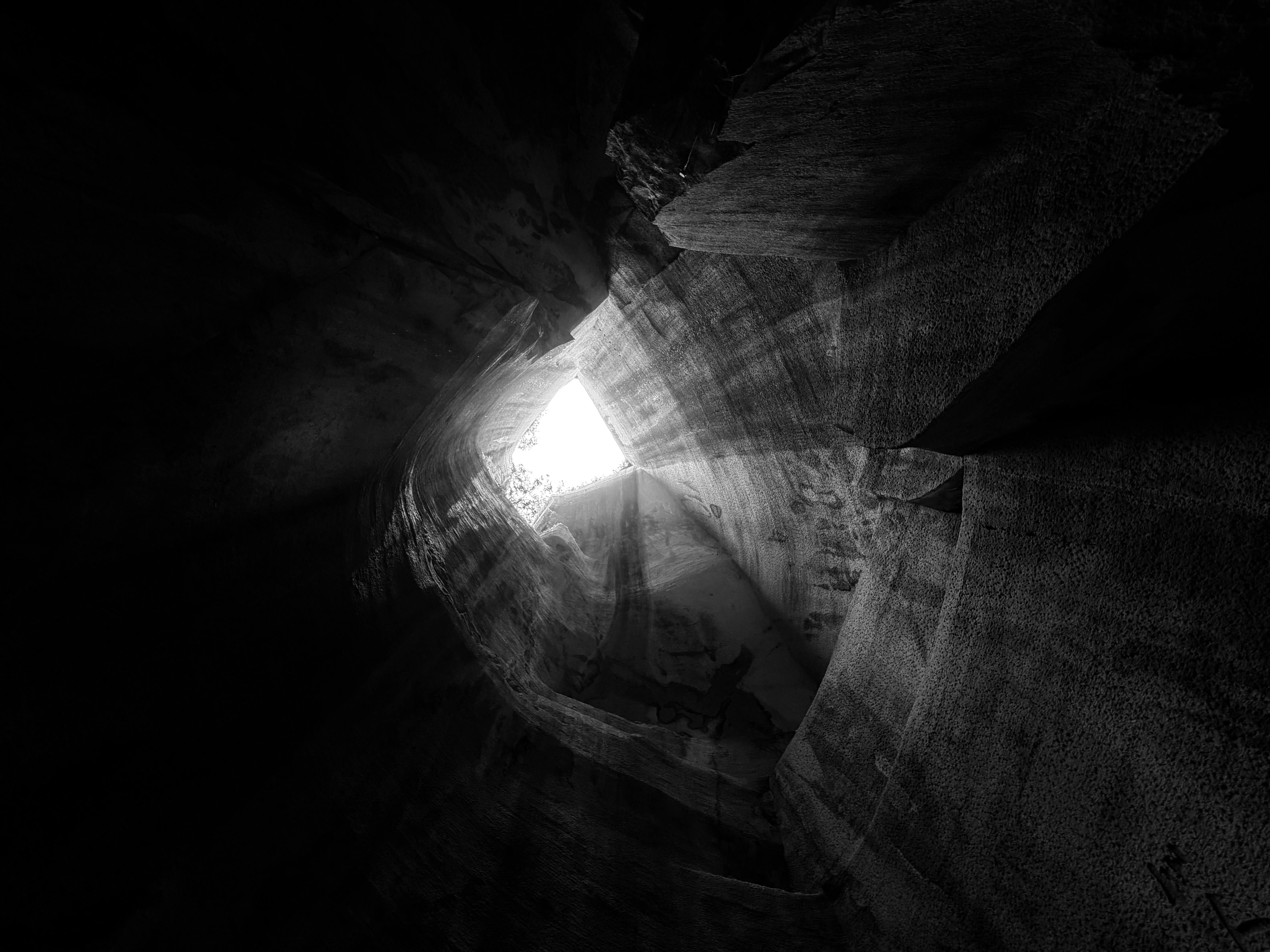 Shadowed Spiral: Light Pierces an Abstract Chasm