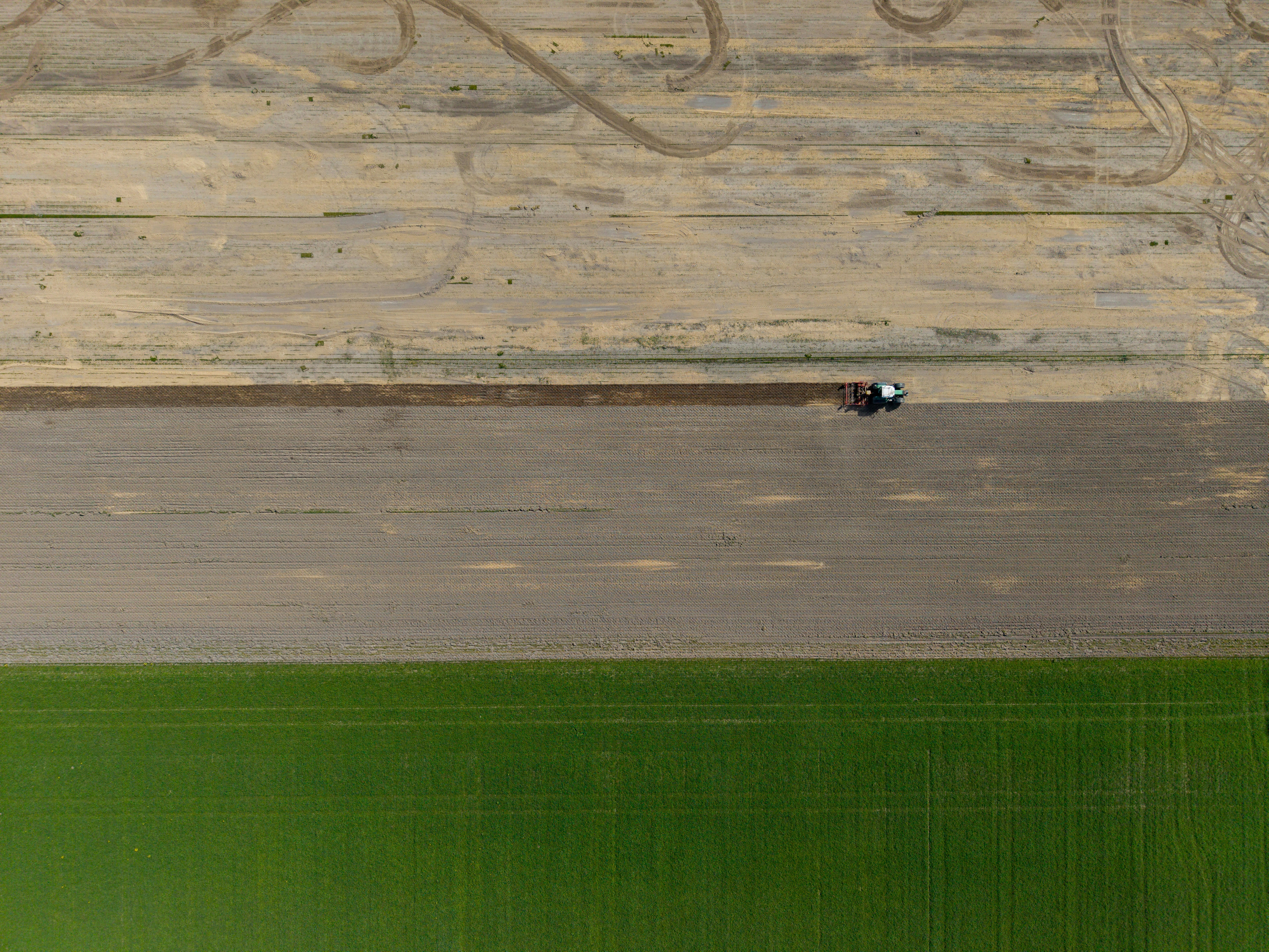 Dusty Road and Verdant Field: A Drone’s Quiet Passage