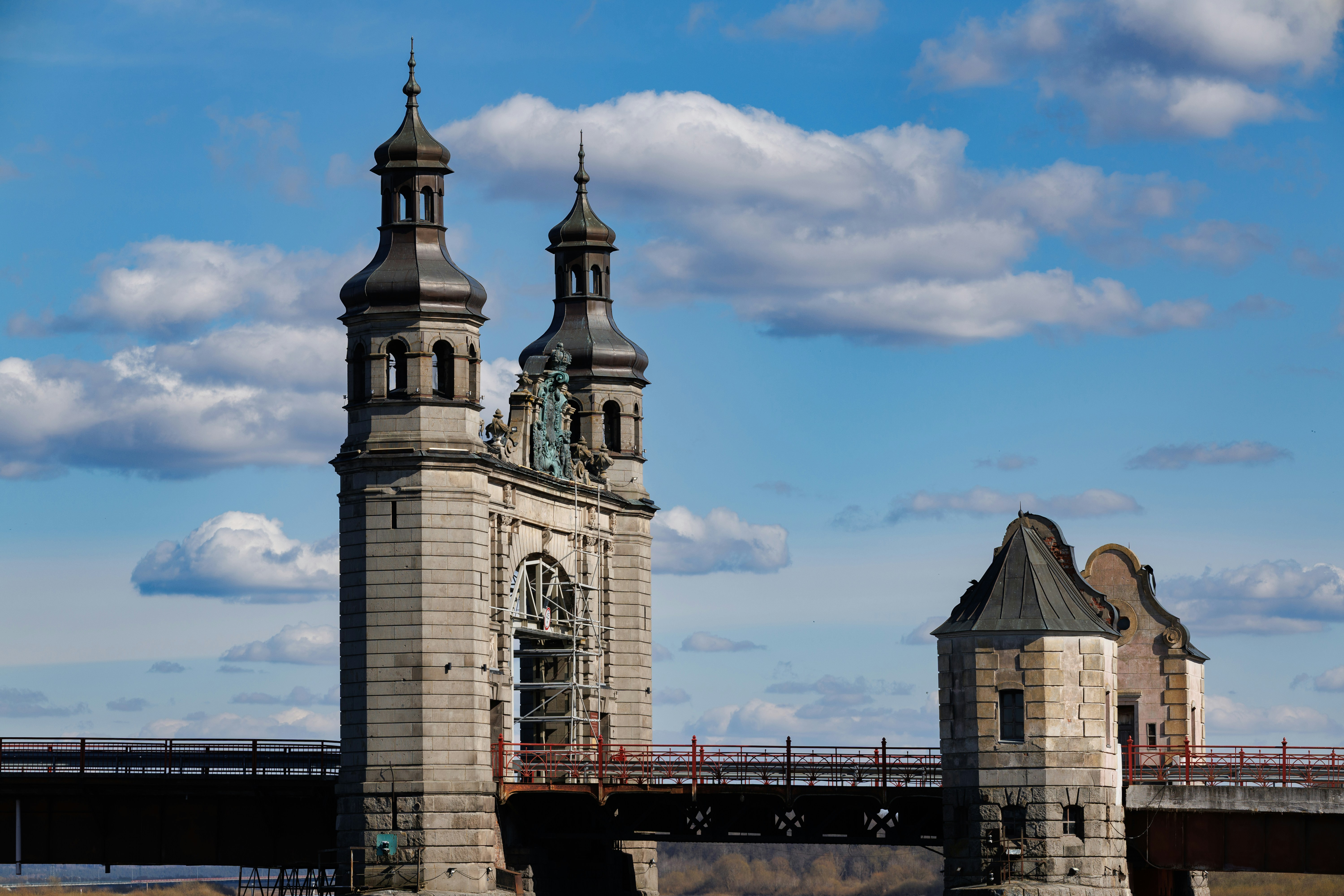 Twin Spires on the Riverfront: A Gilded Bridge Vista