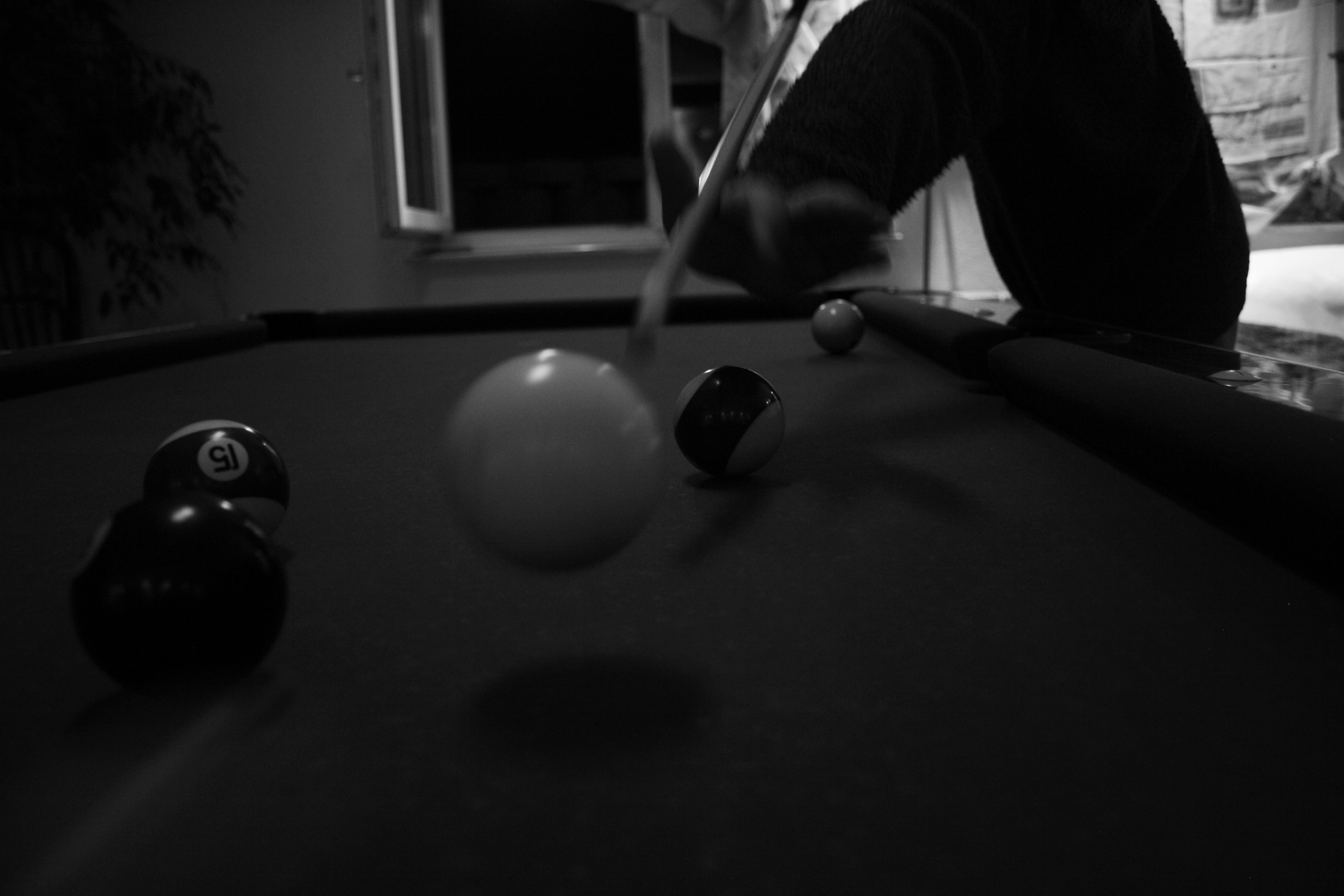 The Silent Cue: A Pool Hall Moment in Low Light