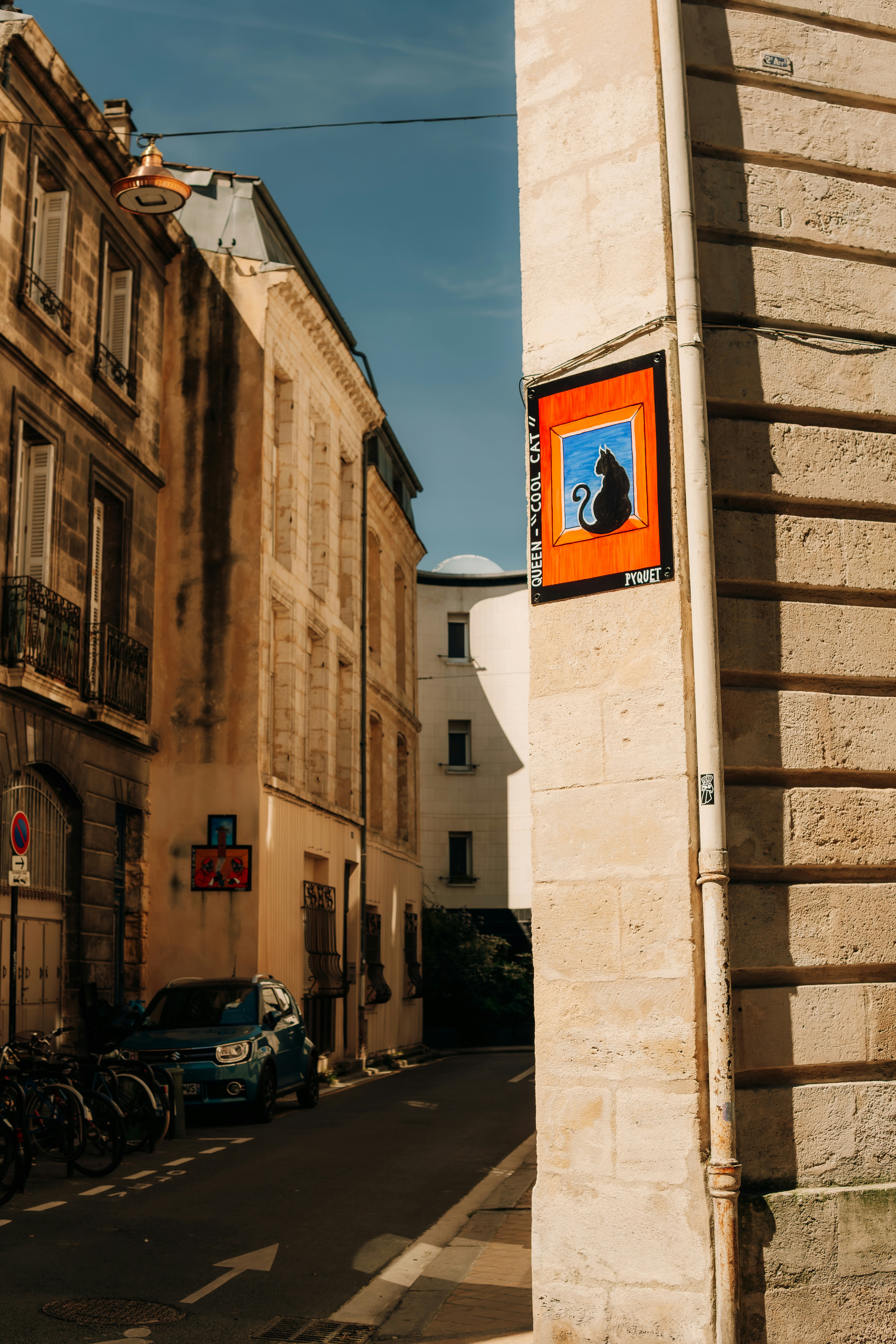 Sunlit Rue with a Cat Portrait Ad