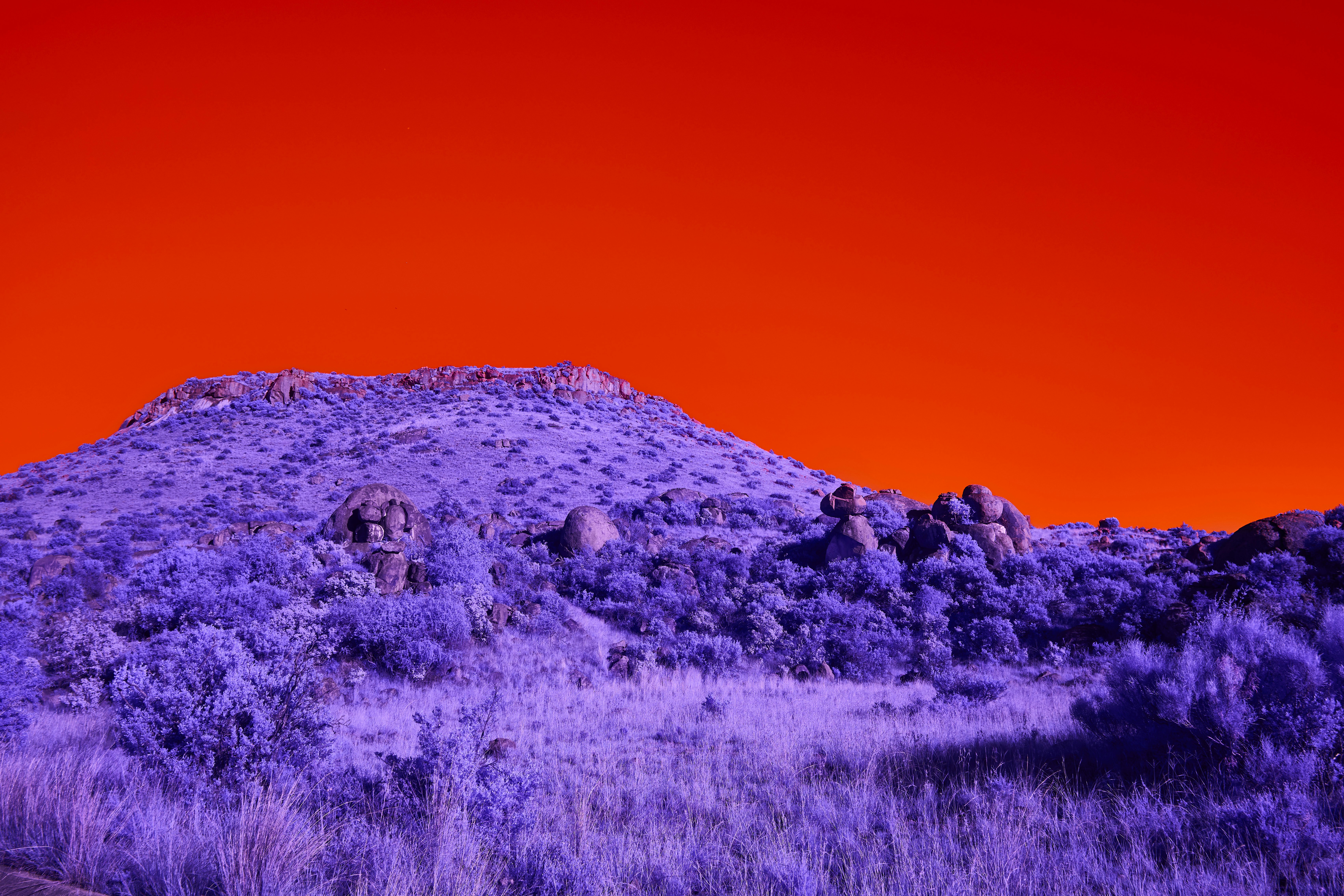 Crimson Sky over Violet Mesa