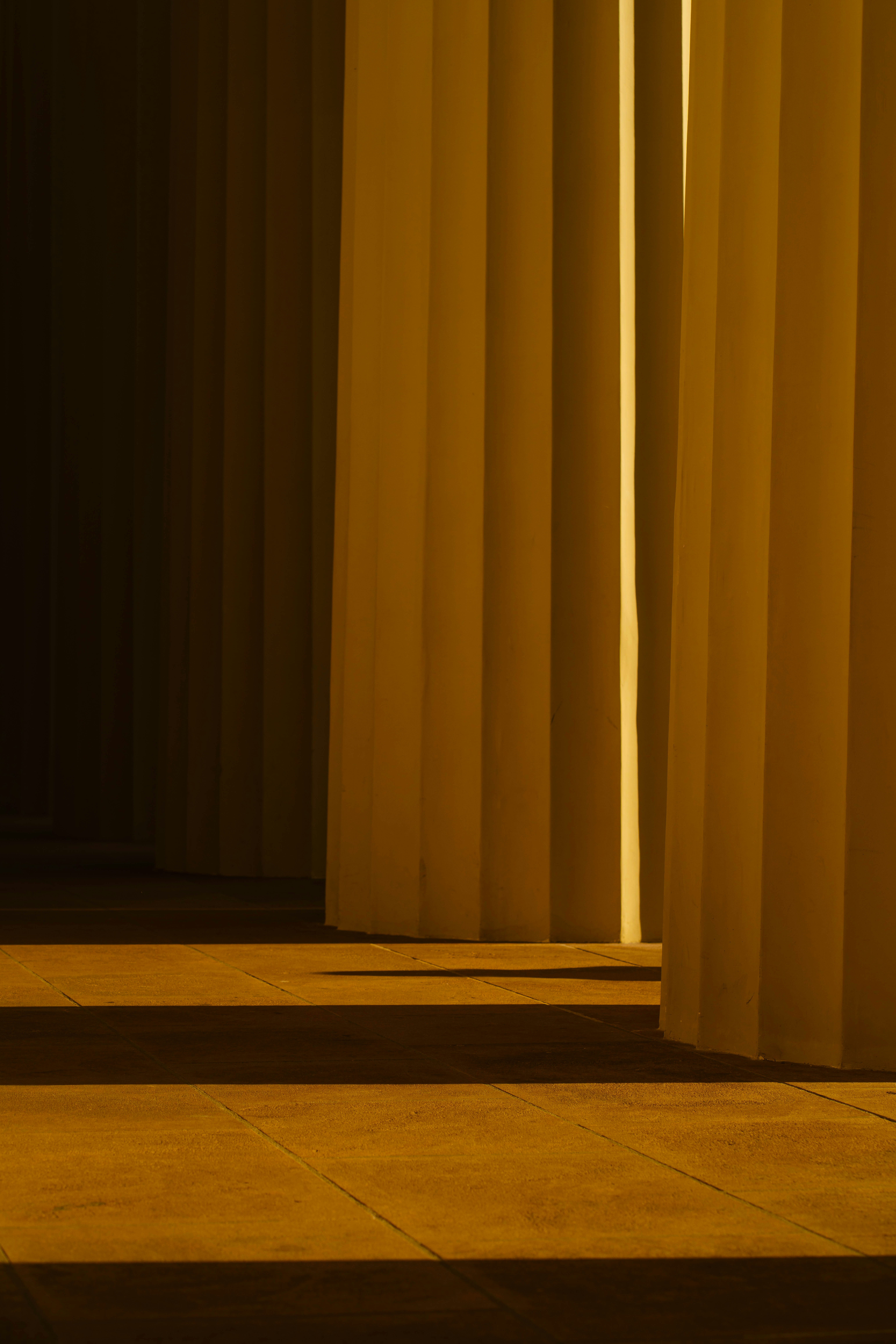Golden Columns and Shadowed Corridor