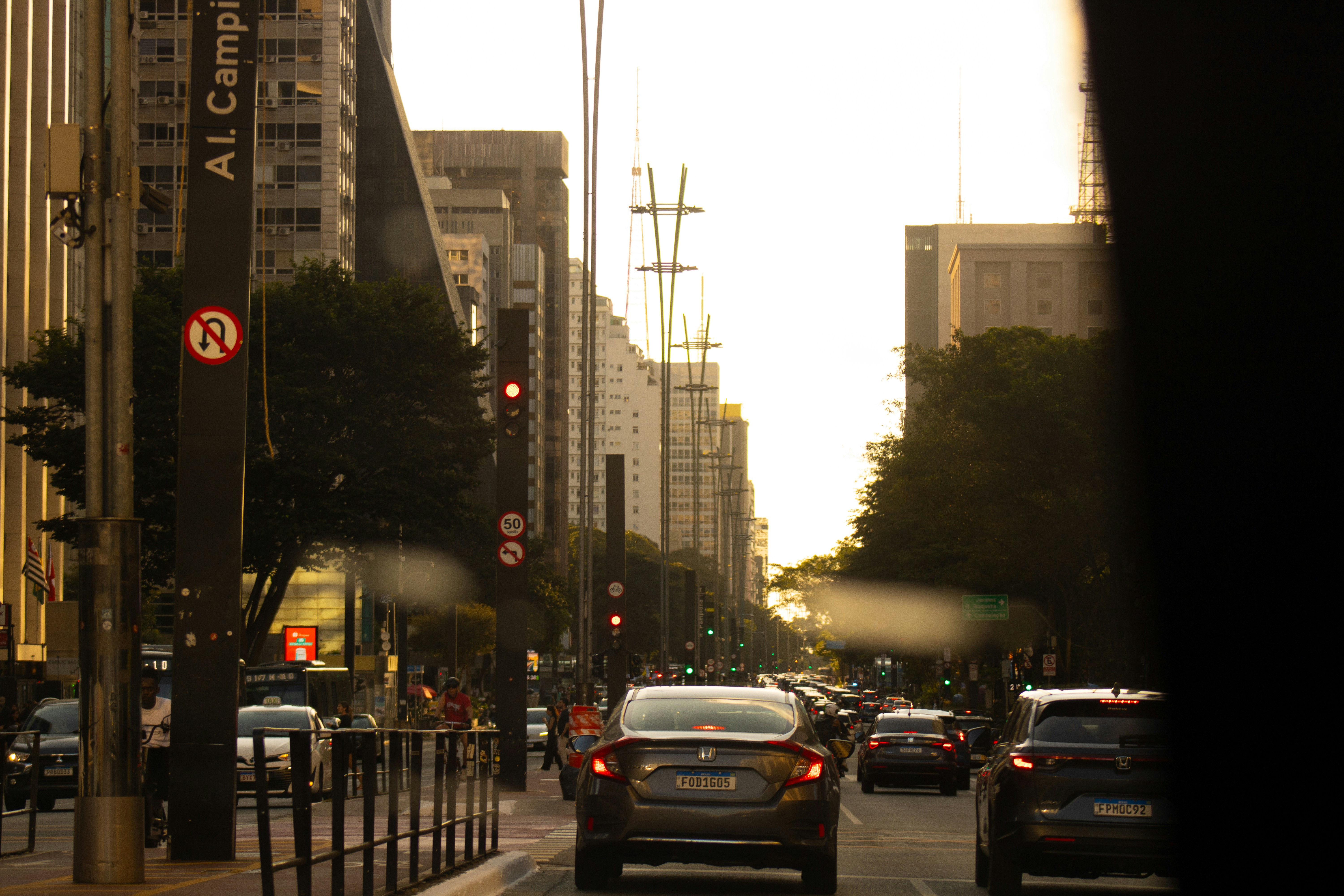Urban Street Symphony: Traffic Converges at Sunset