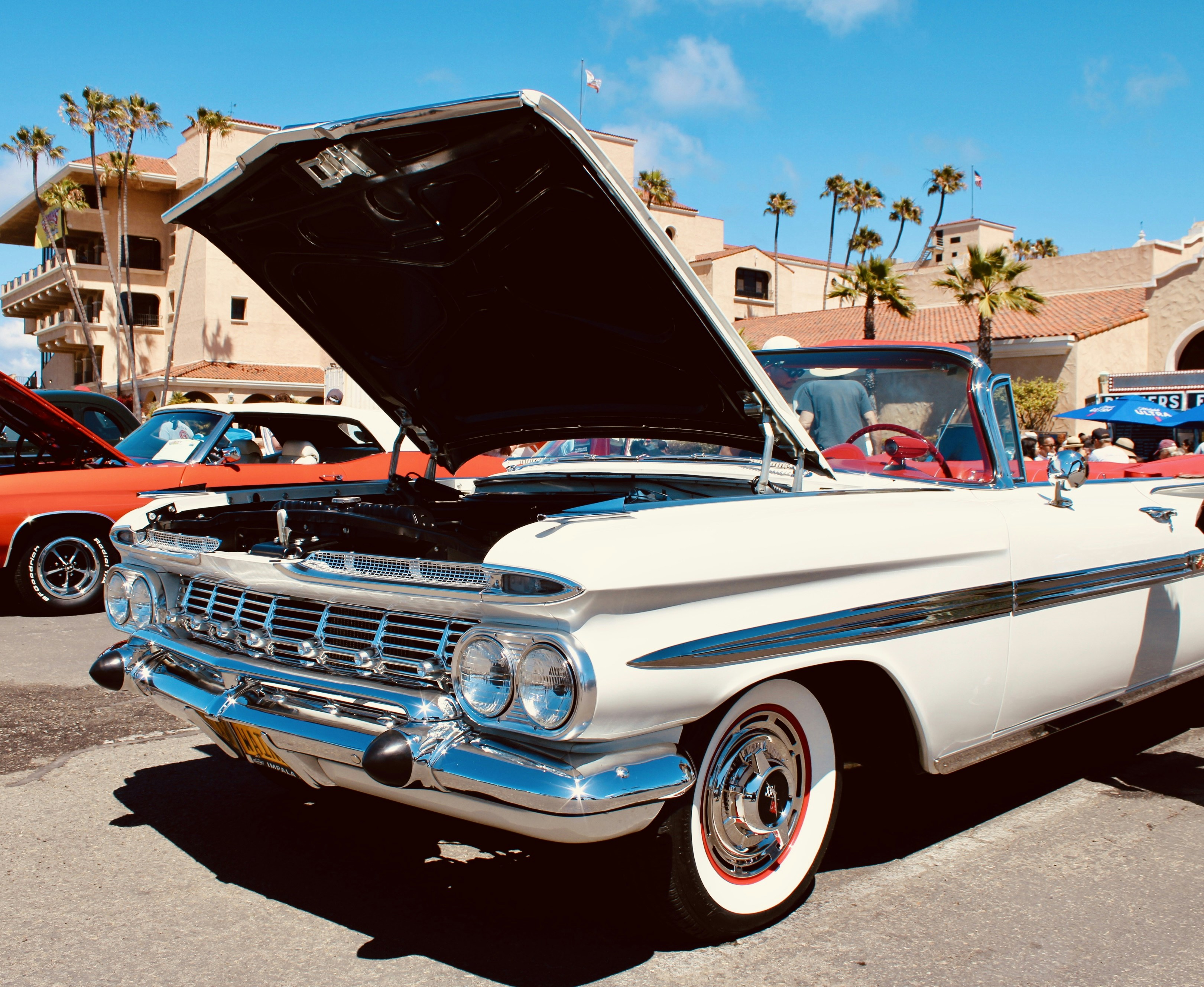 Open-Hood Classic: Chrome and Tailfins at a Desert Car Show