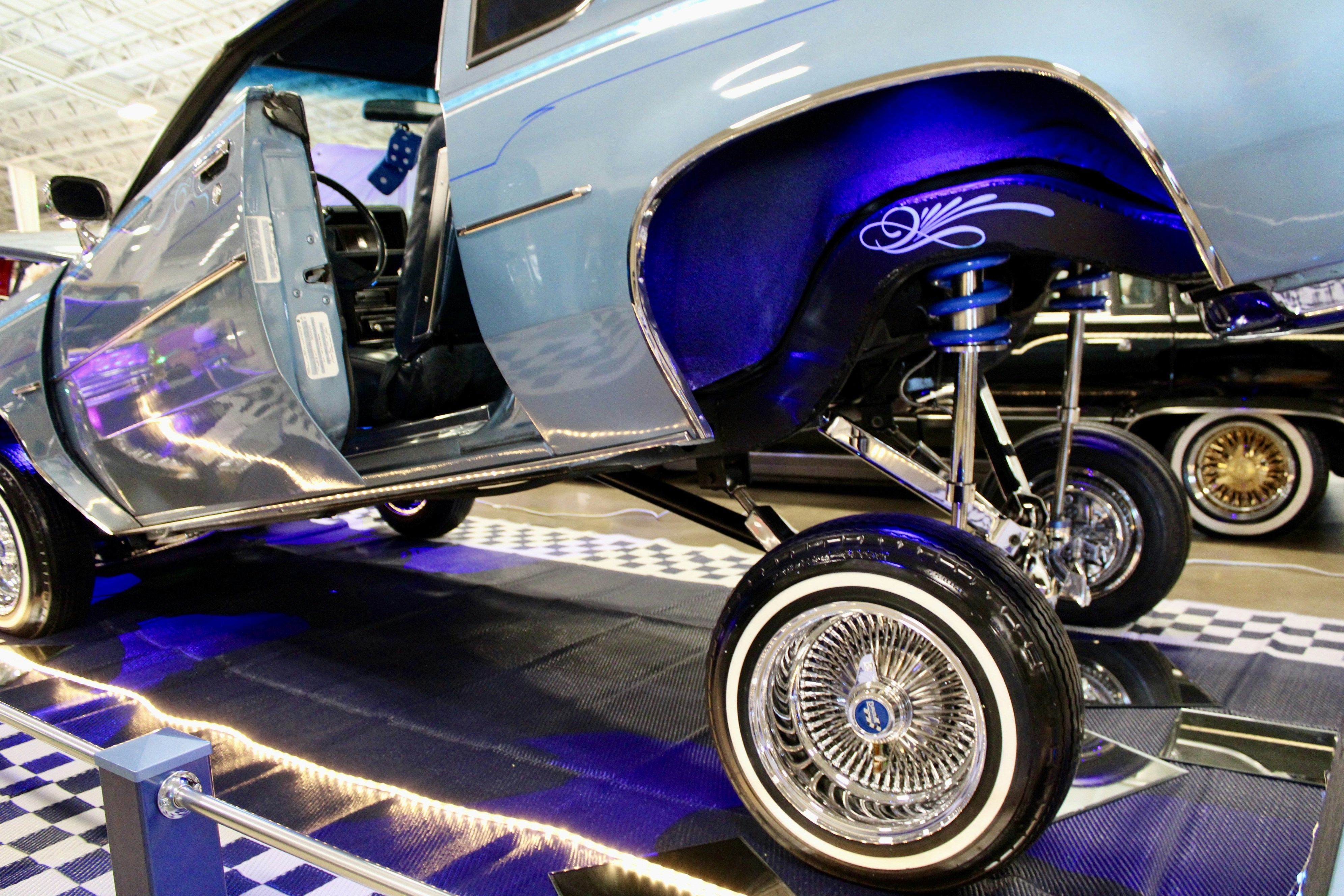 Elevated Blue Classic: Wheel and Suspension Detail on a Restored Car