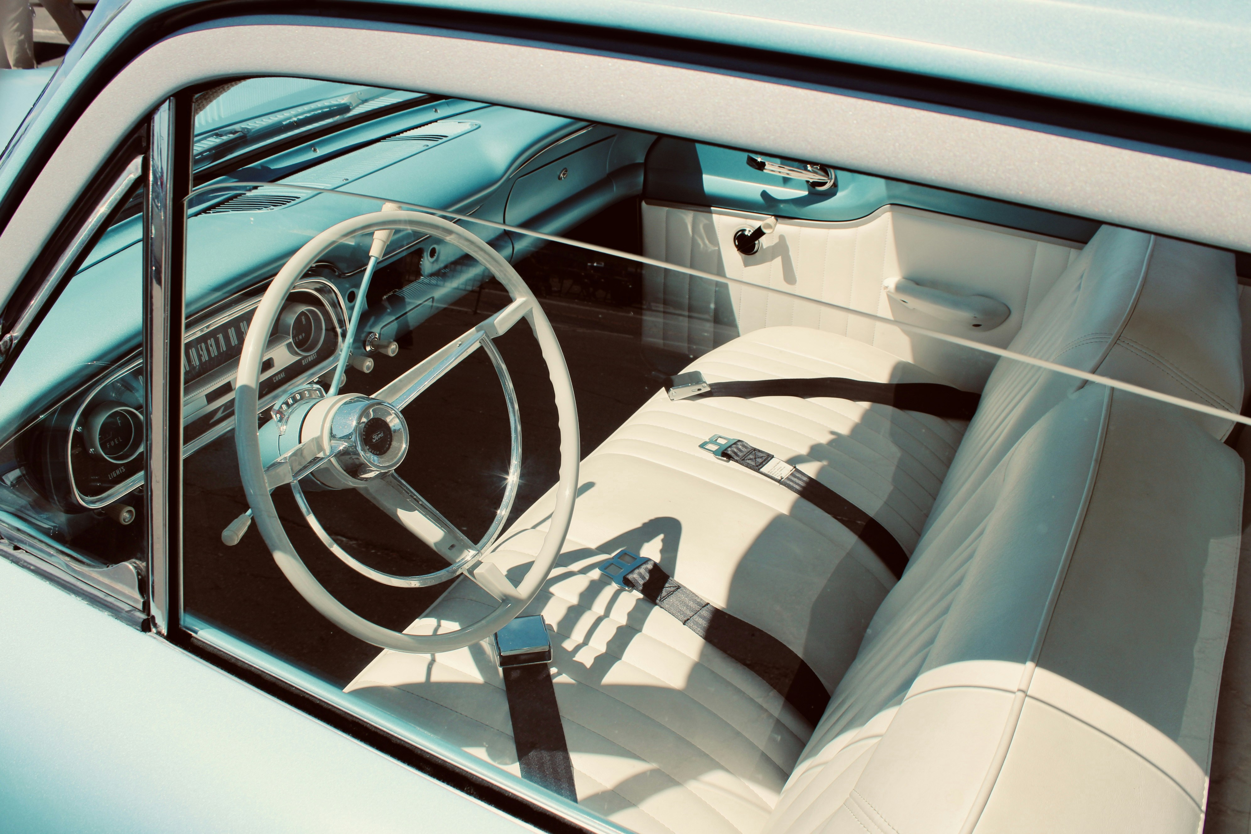 Minty Cushions and Chrome Wheel: A Glimpse into a Classic Car Interior