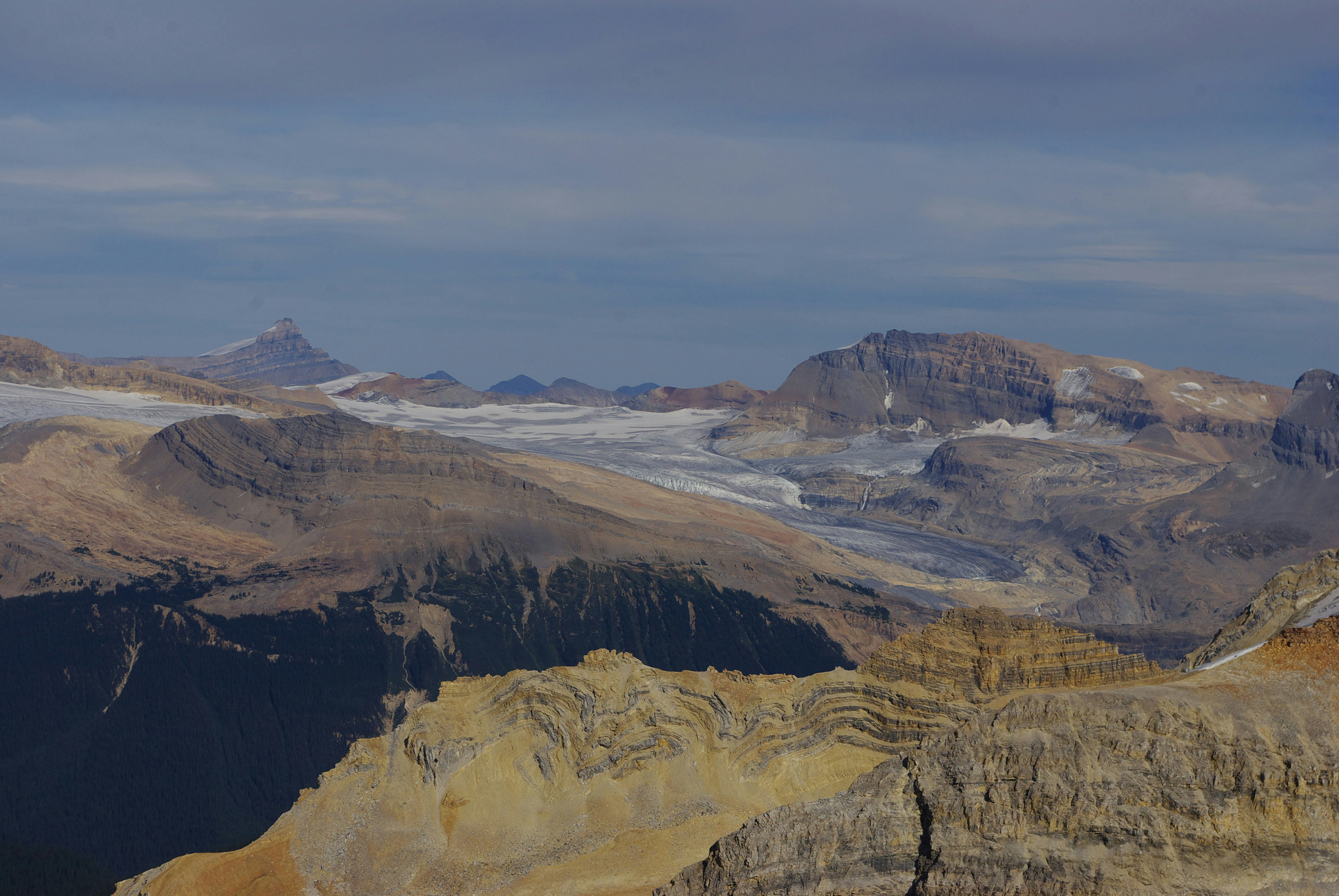 Desert-Rim Panorama: Quiet Ice-Field Between Weathered Cliffs