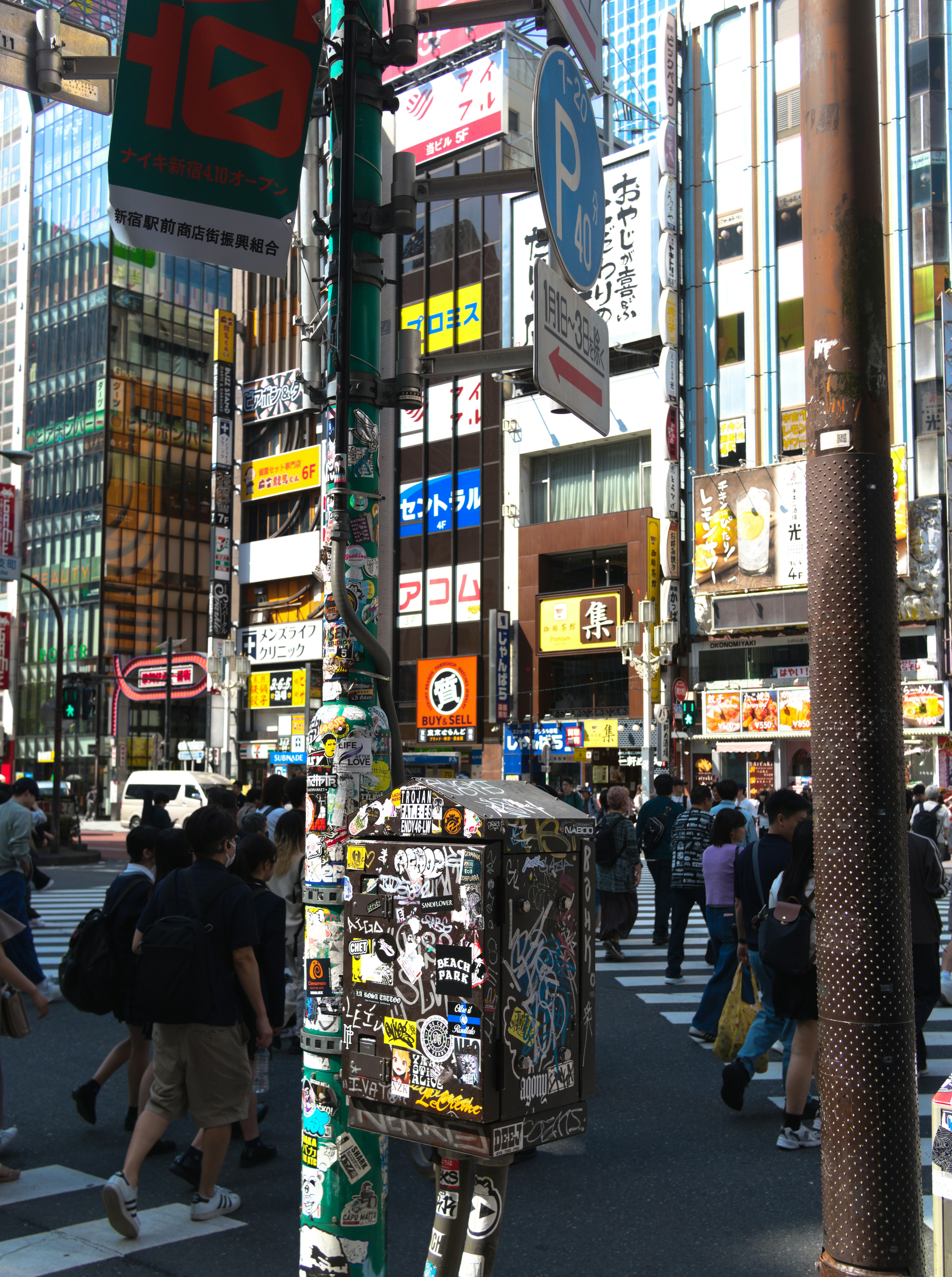 Neon Alley: A Crowded Crosswalk in Tokyo's Pulse