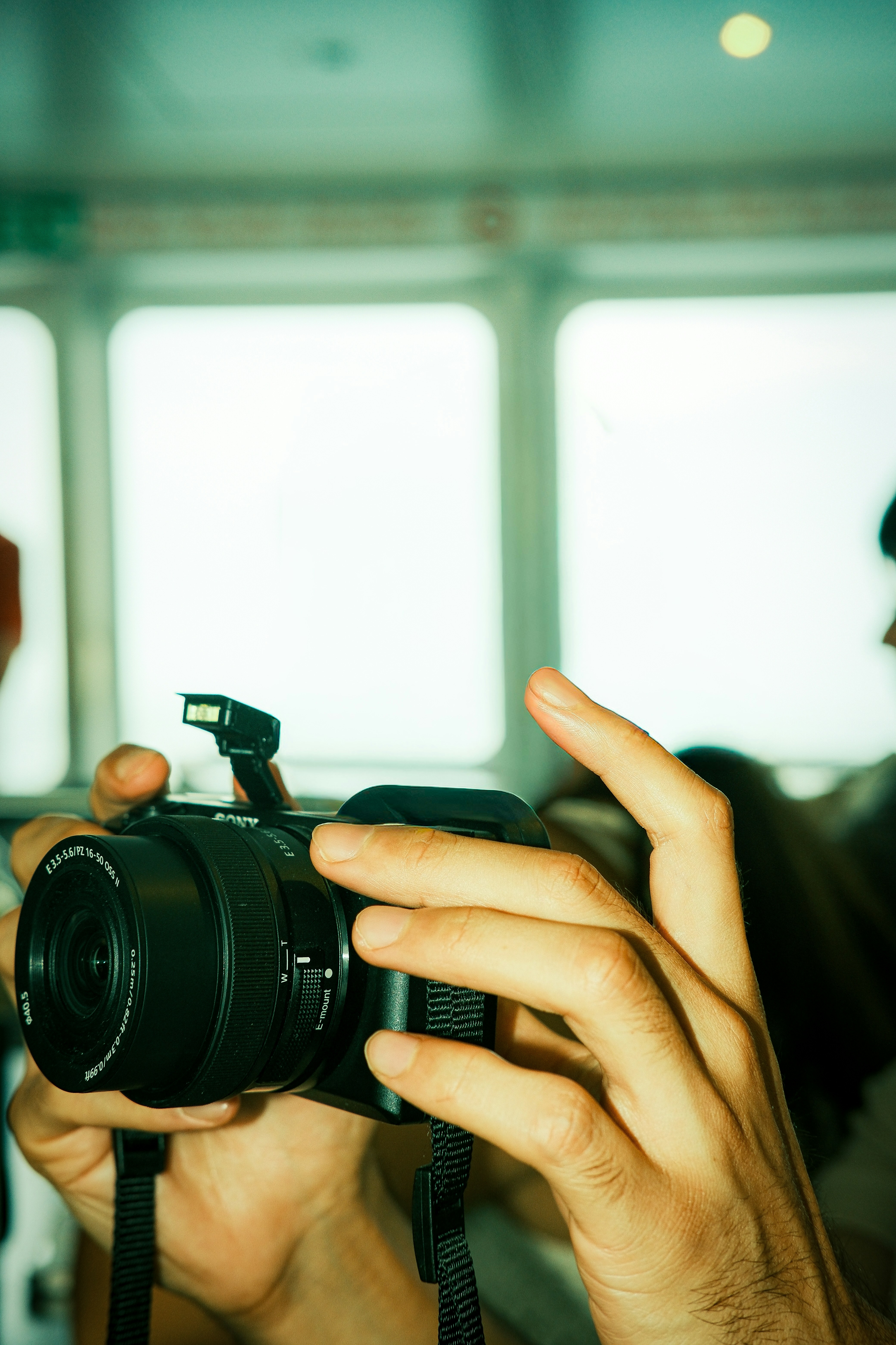 Hands in Focus: A Moment Captured Through a Traveler's Lens