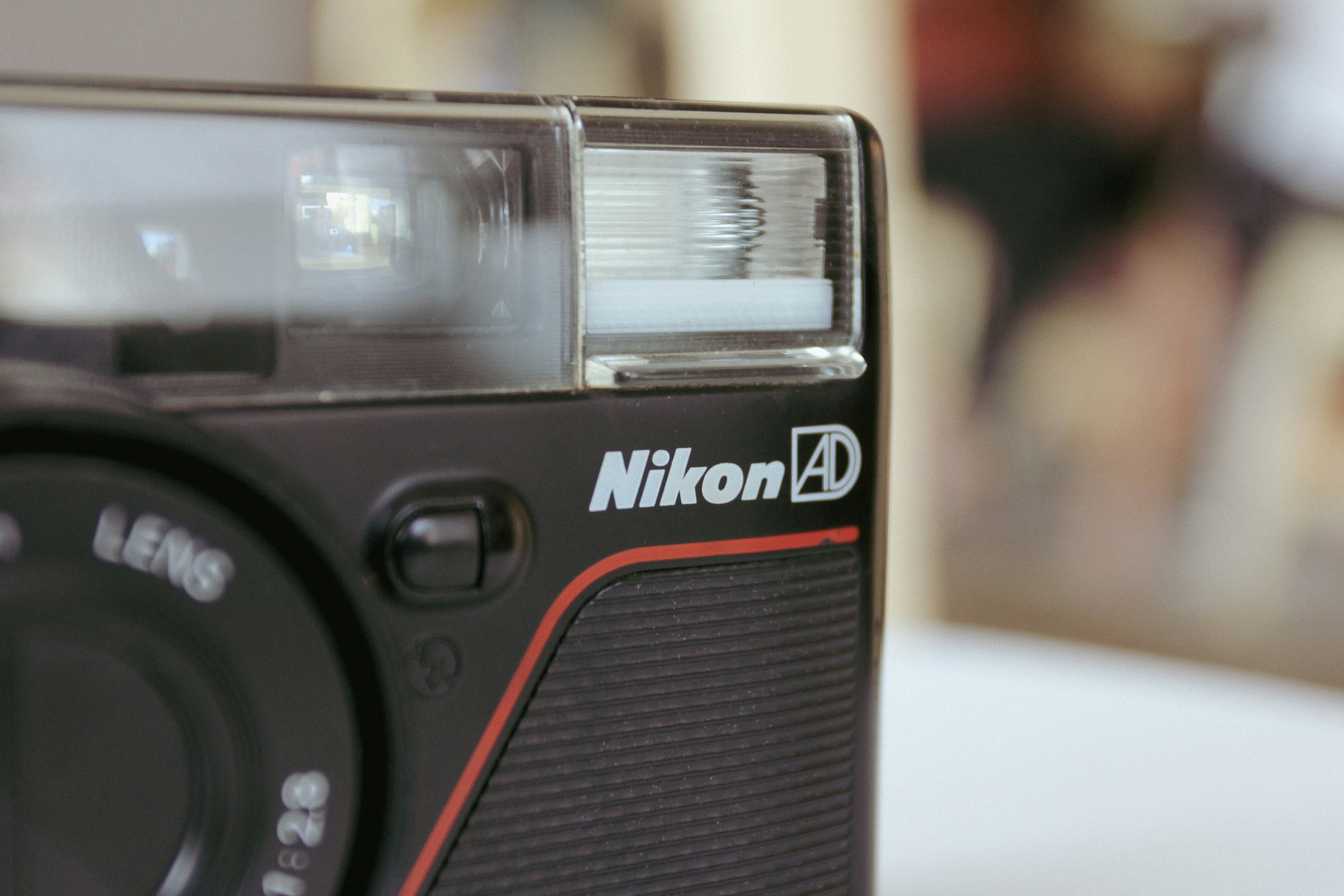 Nikon Ad on a Vintage Compact: A Closer Look at the Front Face