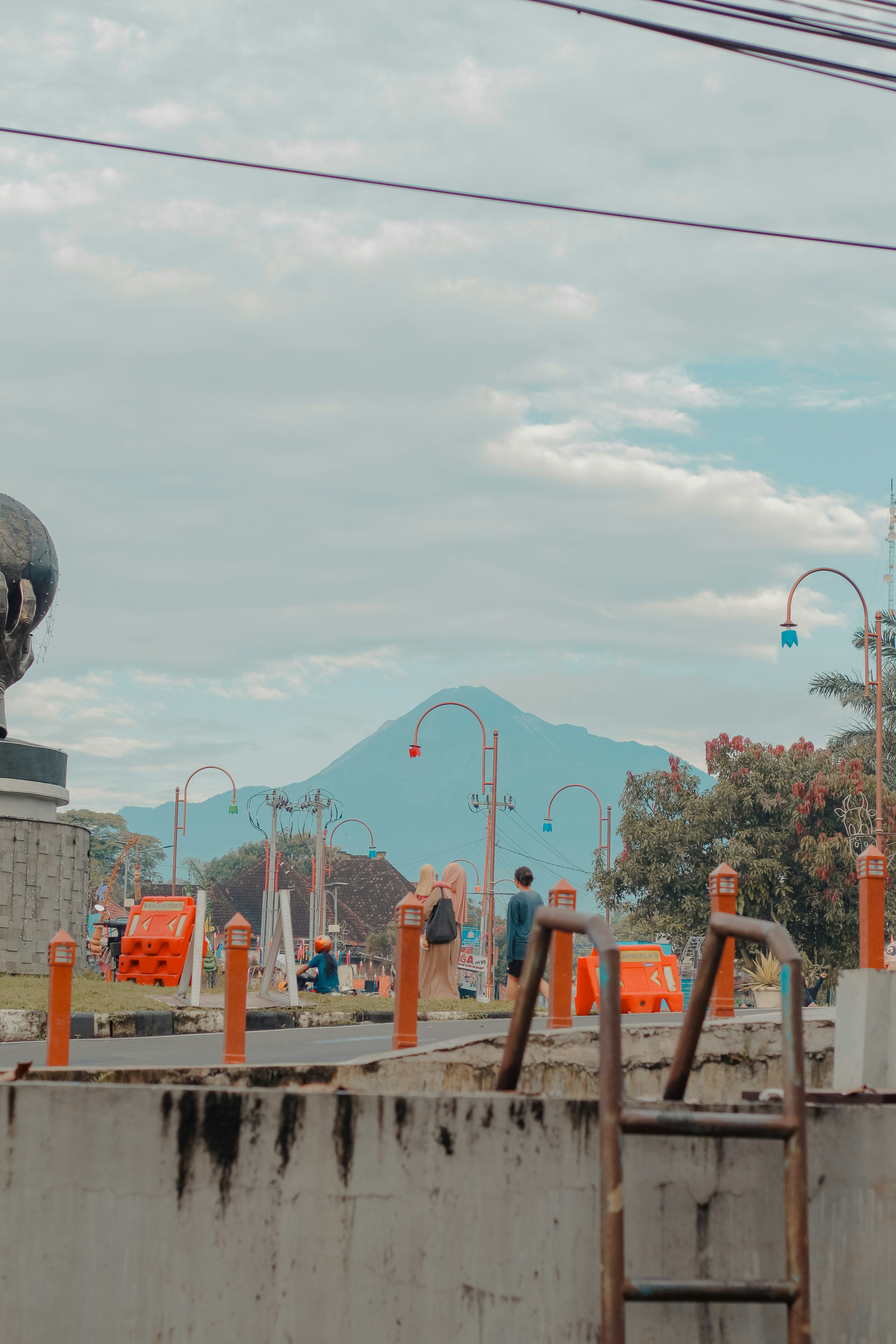Orange Barriers and Distant Mountain Silhouette