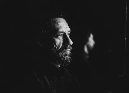 Stark Contemplation: A Quiet Portrait in Shadows