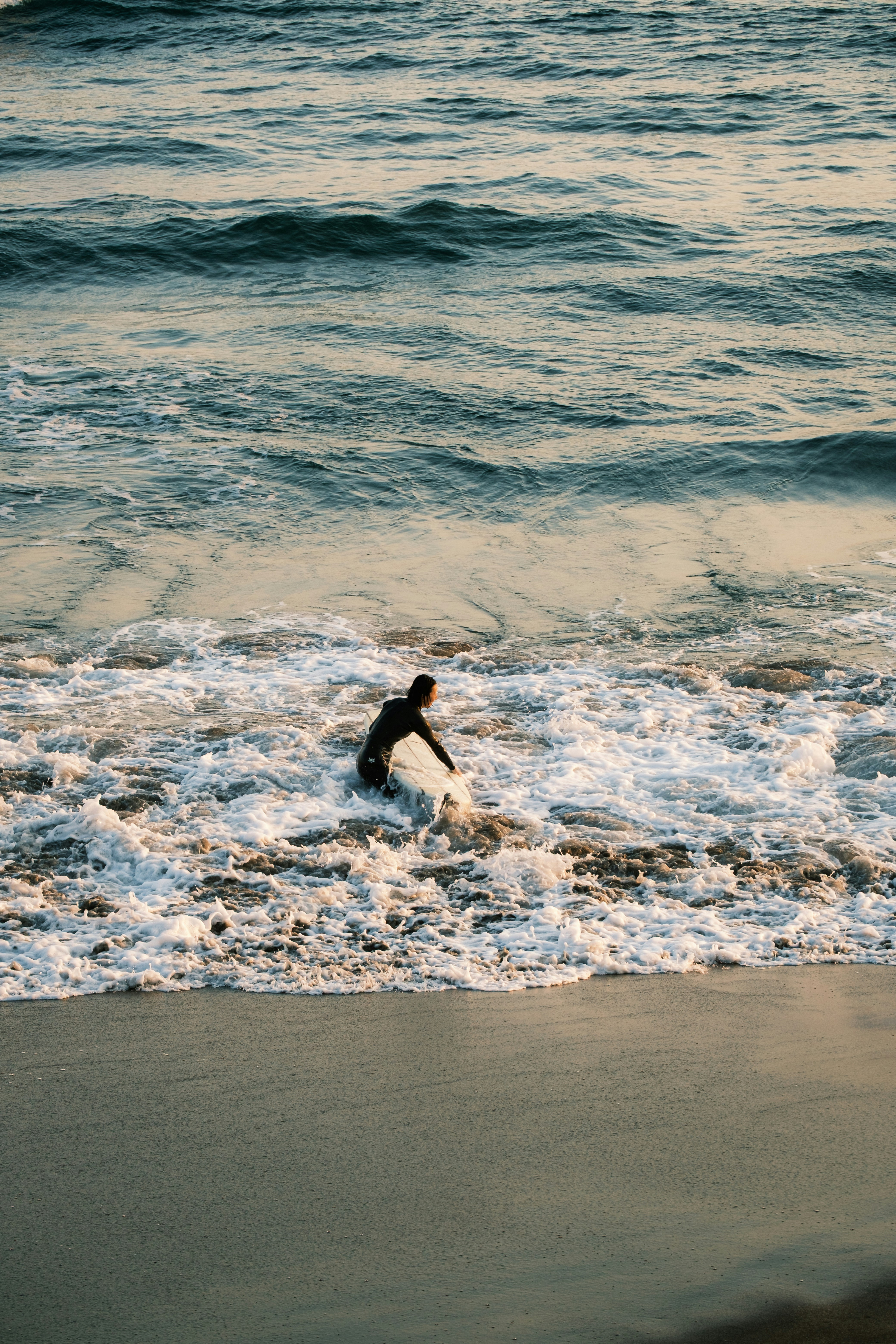 Surfer in the Aegean Light: One Figure Among Gentle Waves