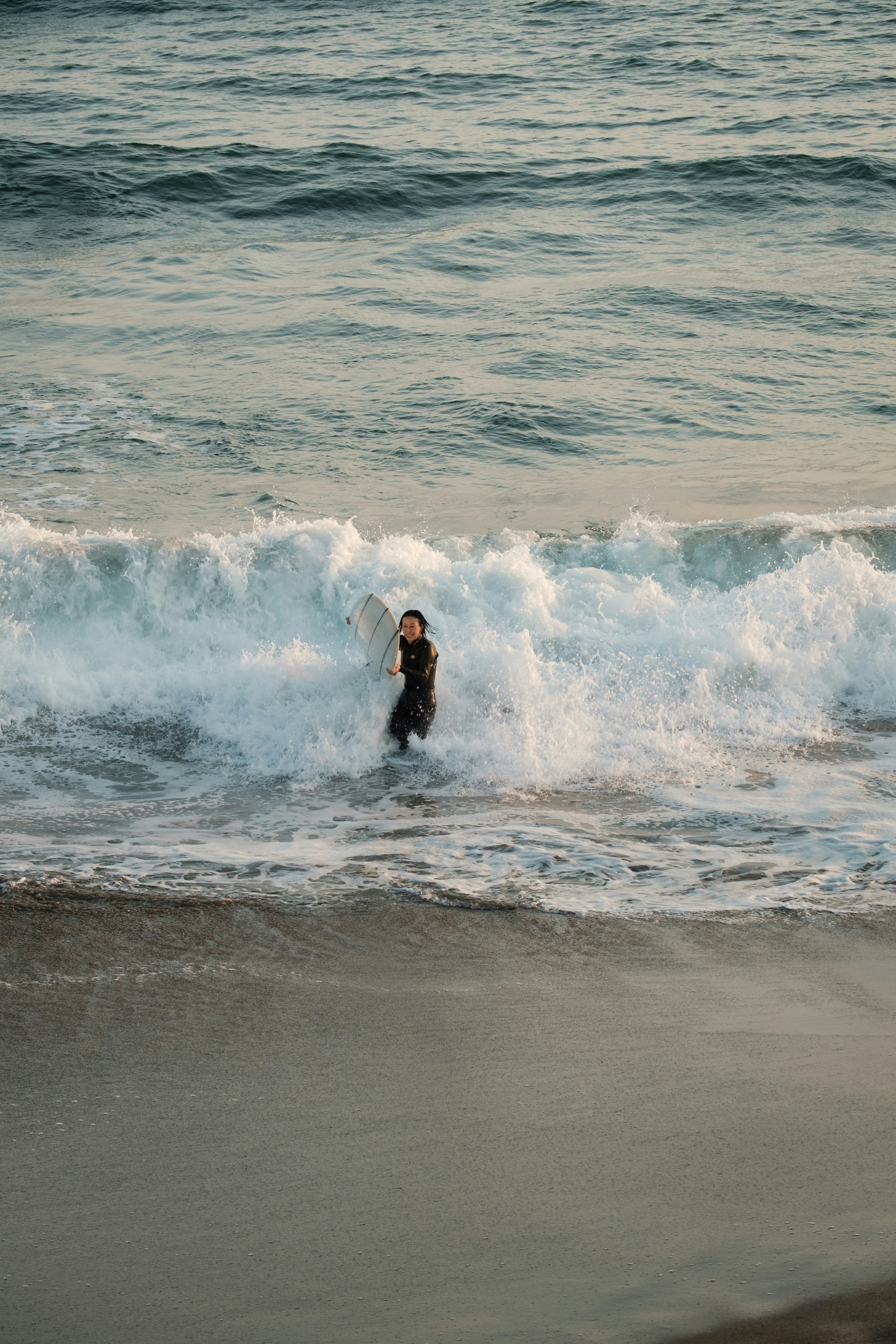 Surfer Rising with a Cresting Wave