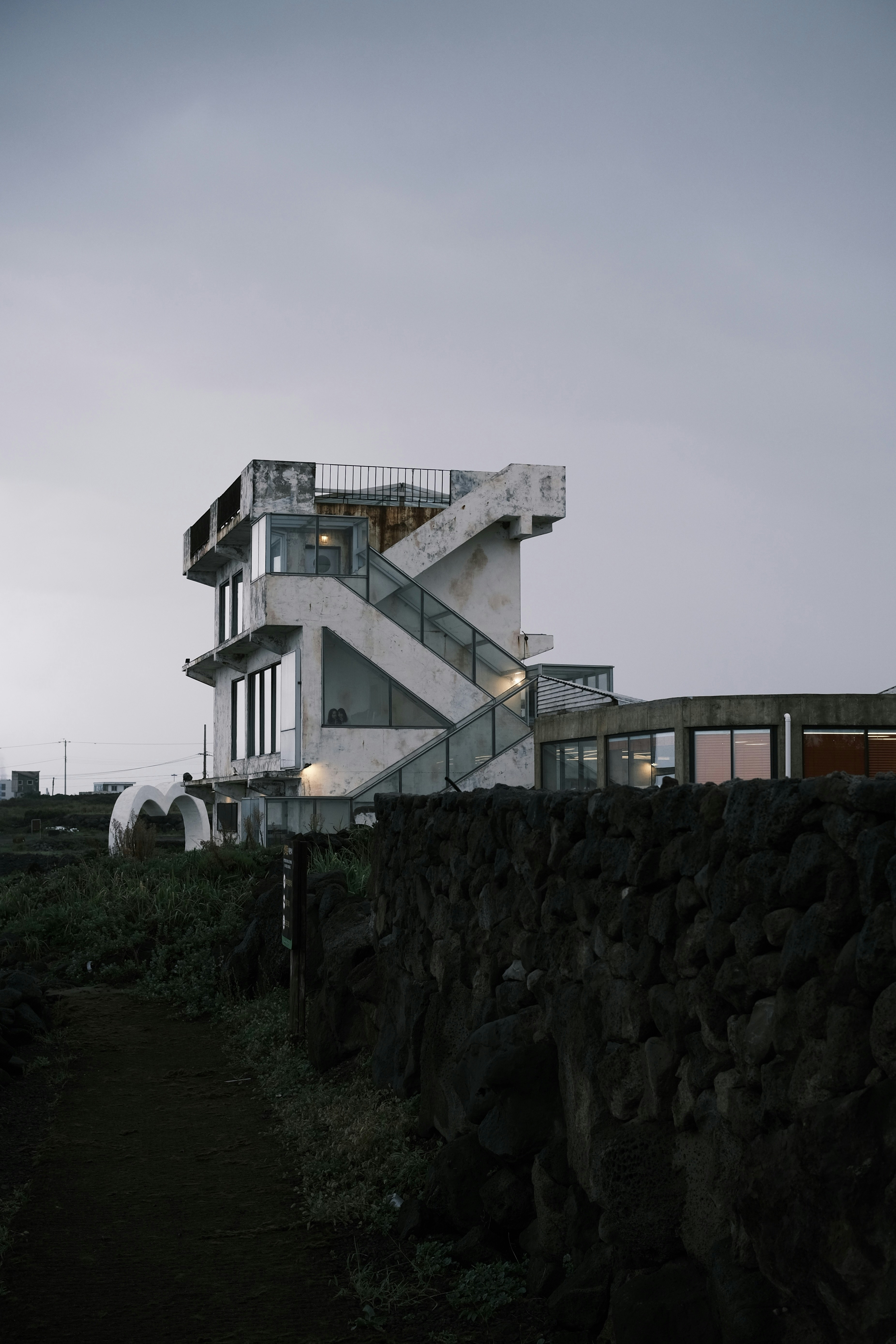 Concrete Observation Tower Rises Over a Rugged Seacliff