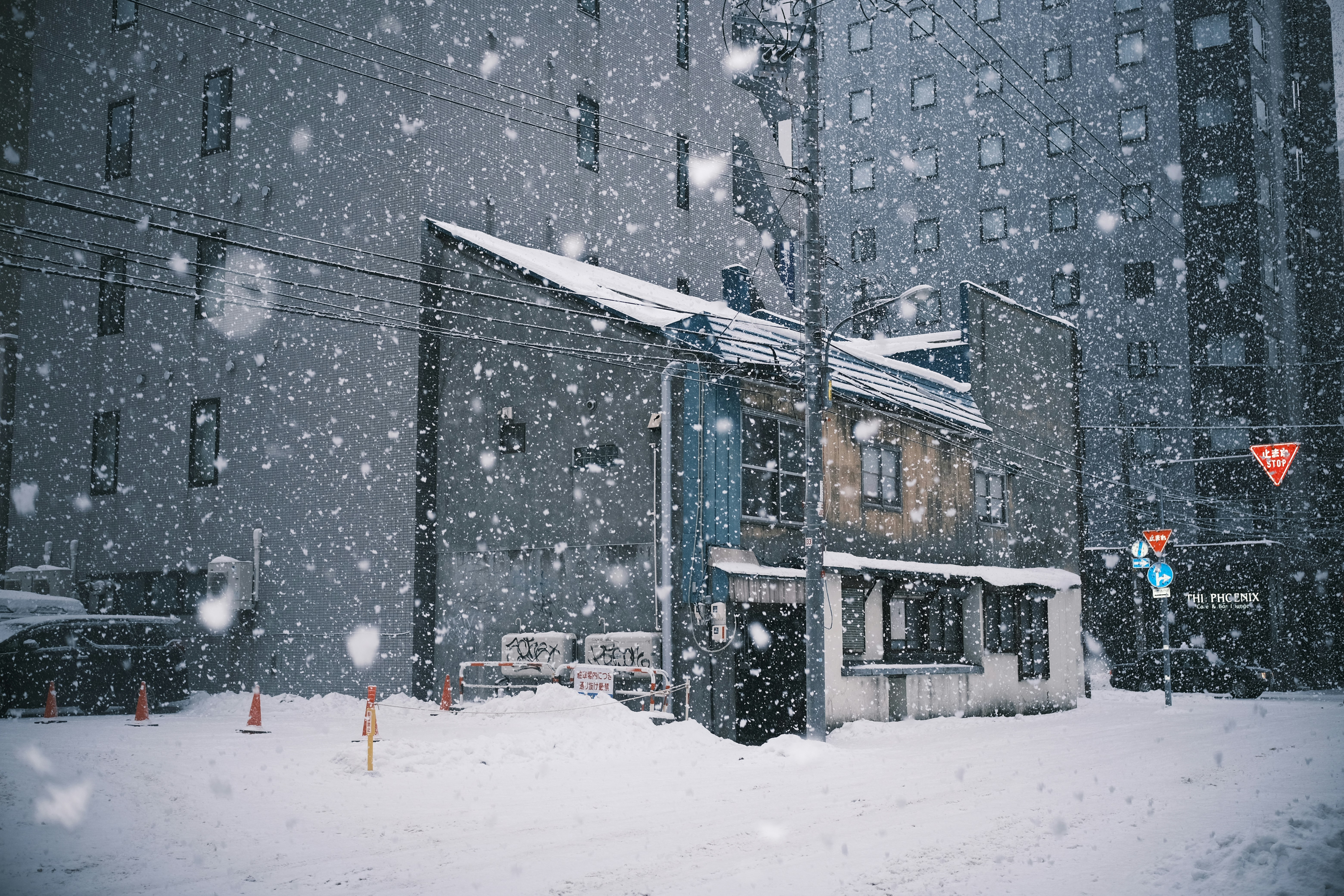 Snowfall Over an Urban Corner: A Quiet Winter Morning by the Storefront