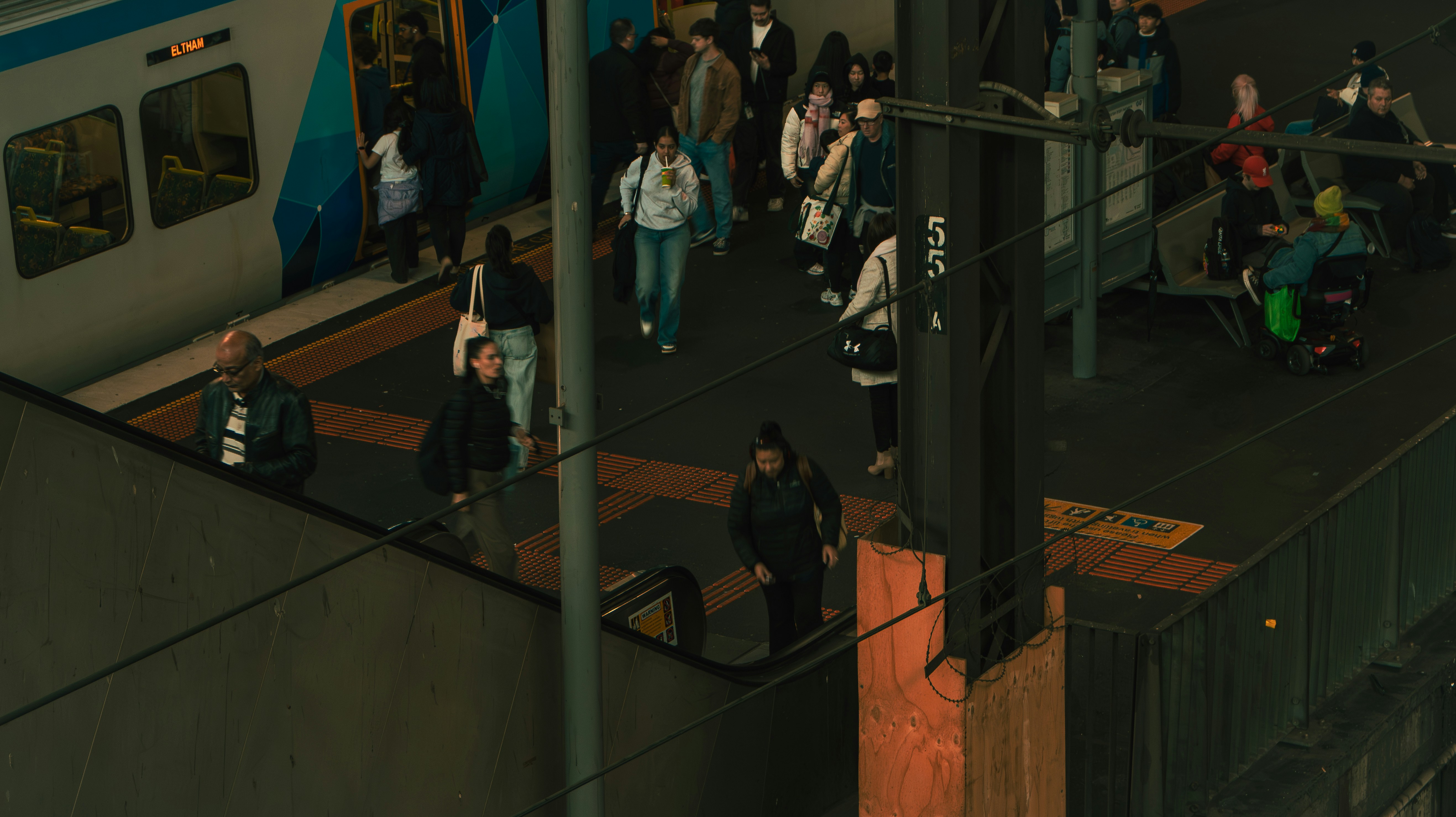 Platforms of Quiet Motion: Commuters in a Dim Terminal