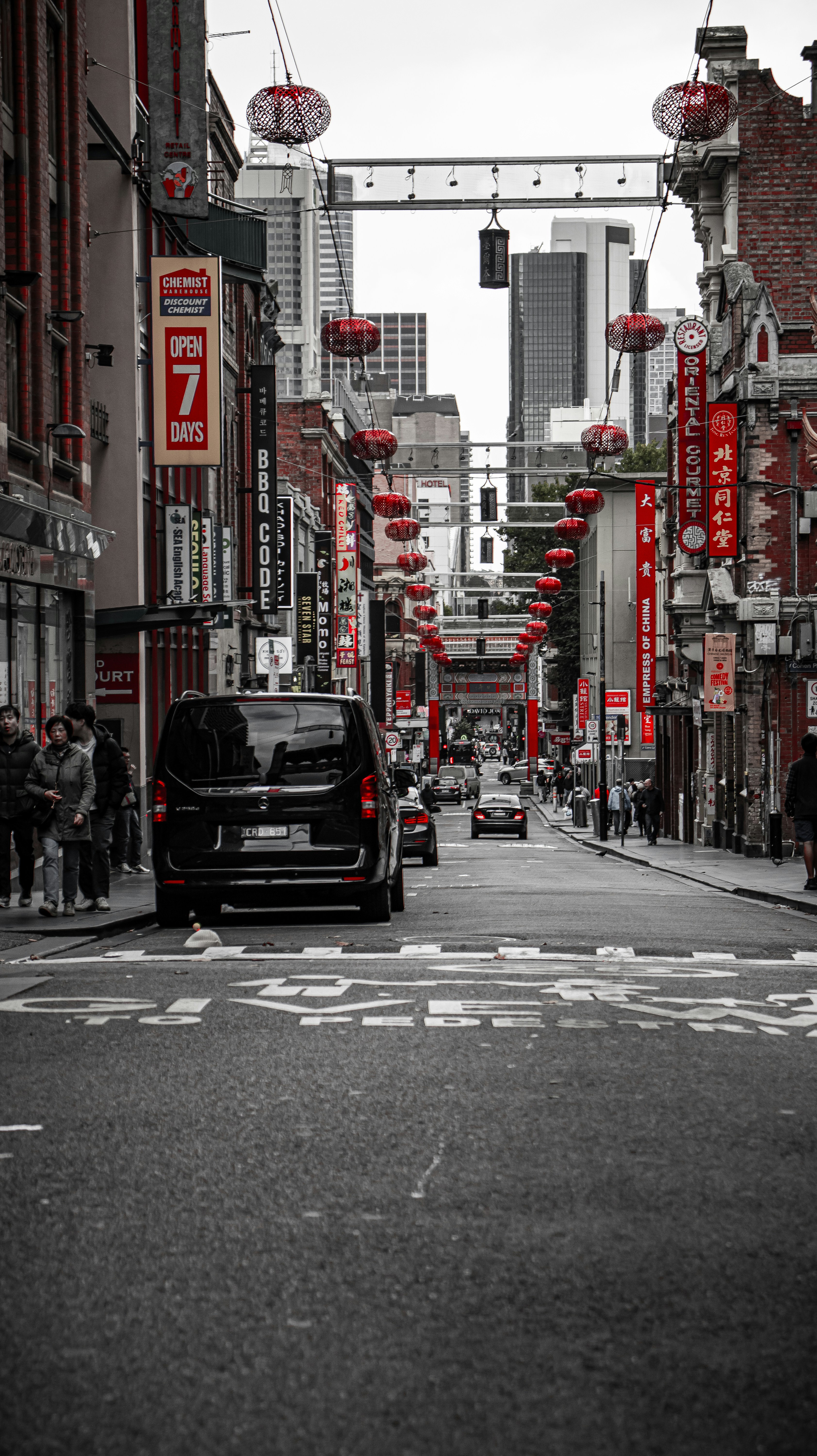 Lantern-Lit Alley: A Busy Chinatown Street Stretches into the Distance