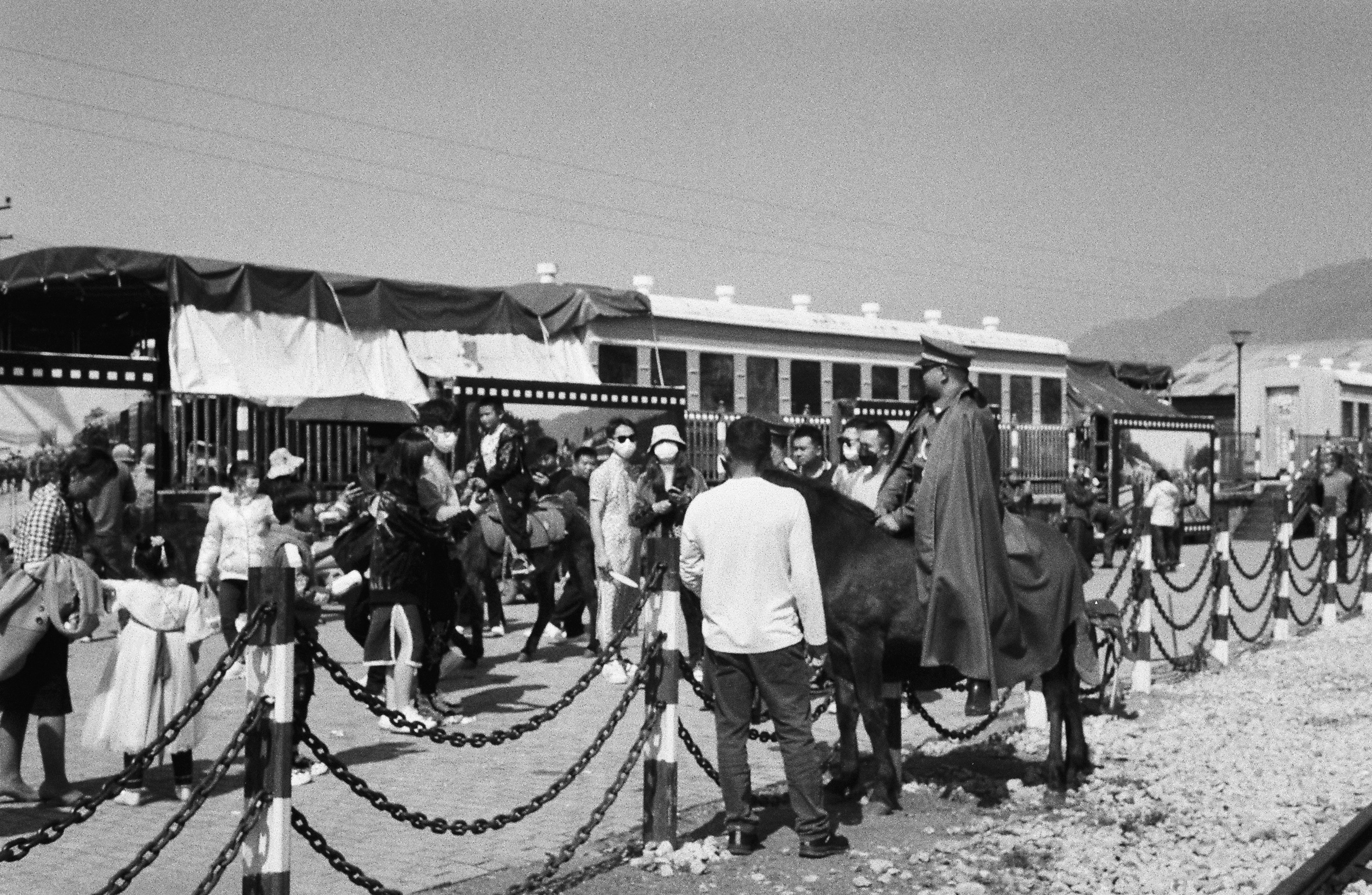 Circus Grounds: A Line of Spectators and a Mounted Performer