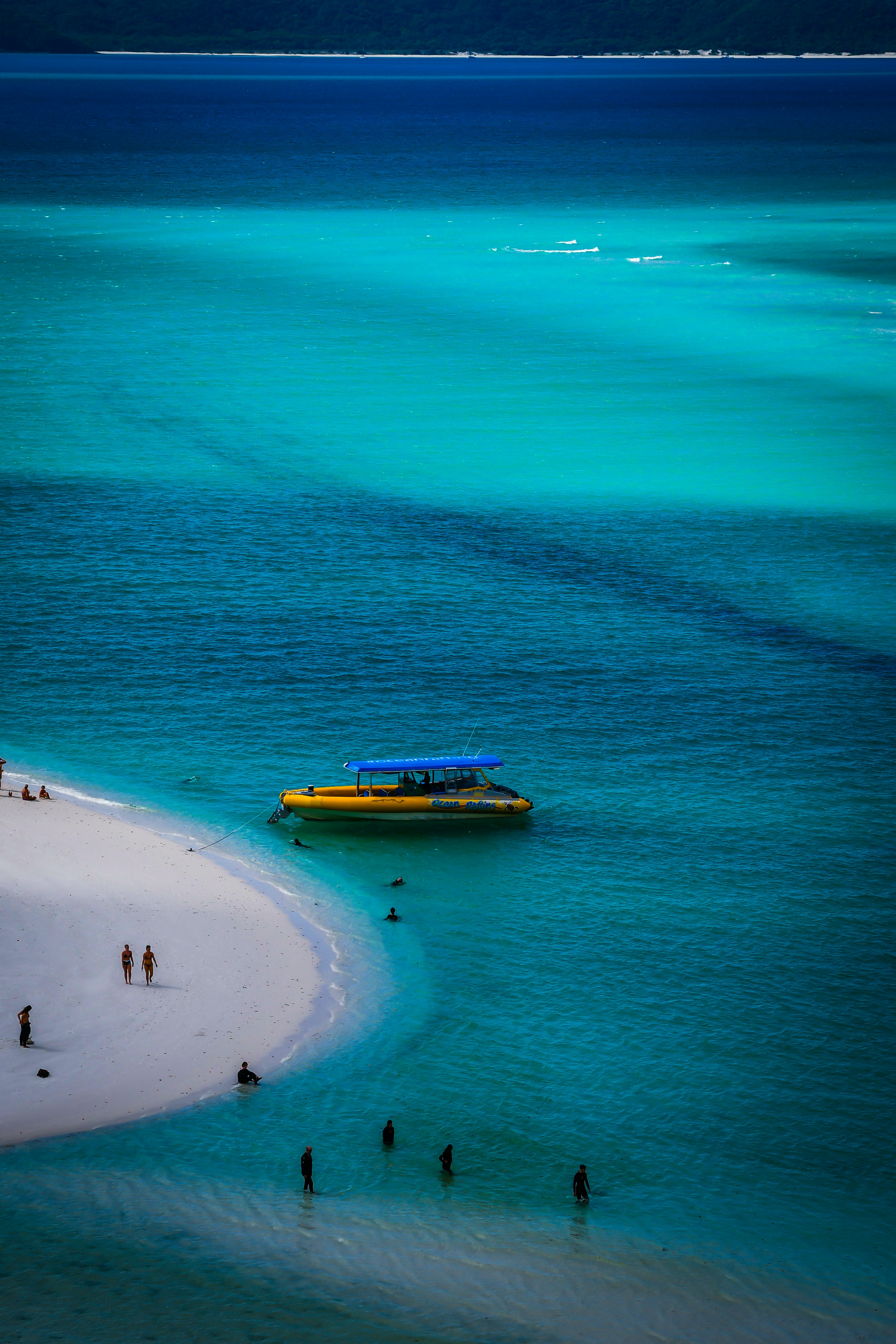 Turquoise Shoreline: A Beach Rescue Boat Anchored by Coral Waters