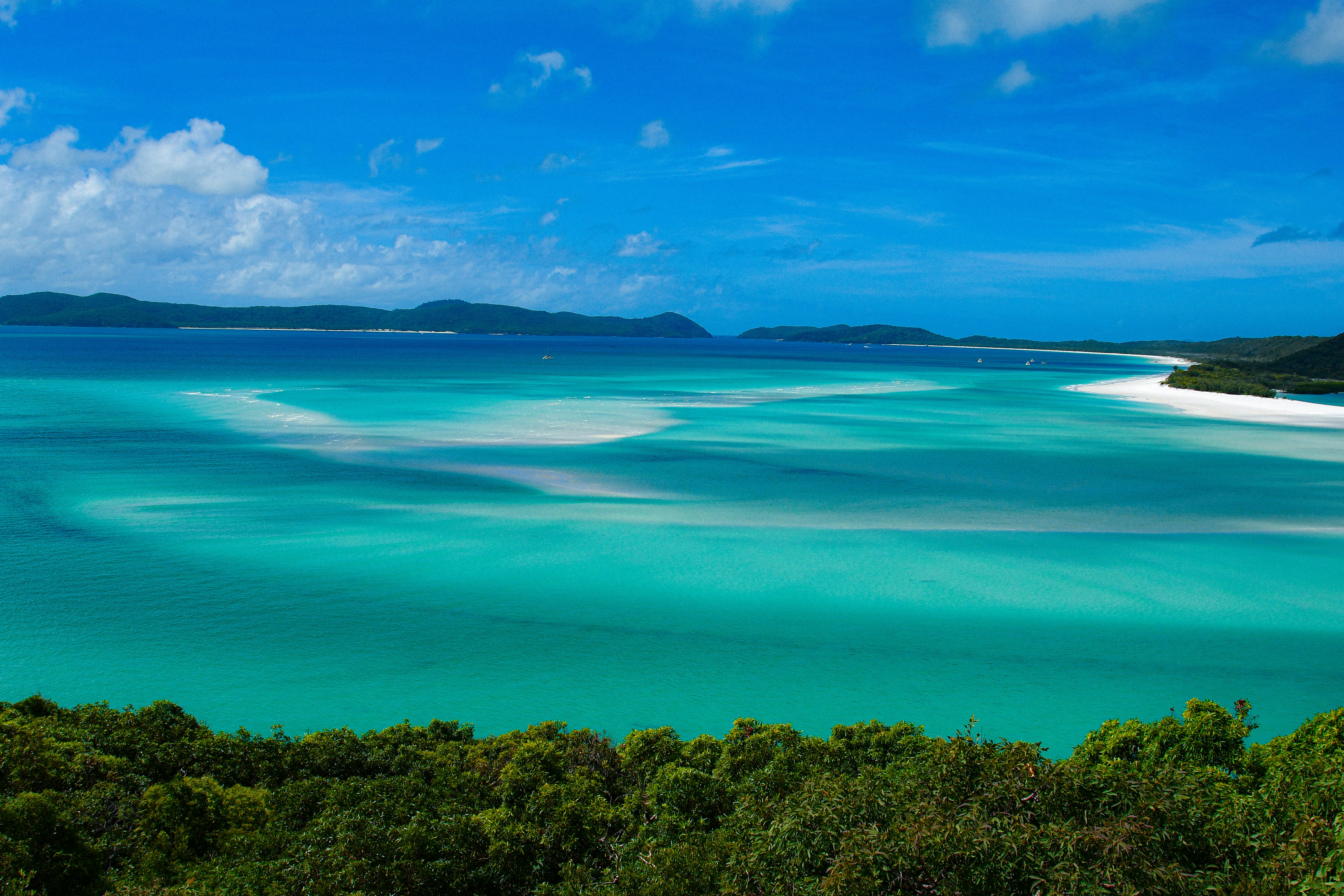 Azure Ribbon: A Coral-tinged Lagoon Meandering into the Horizon