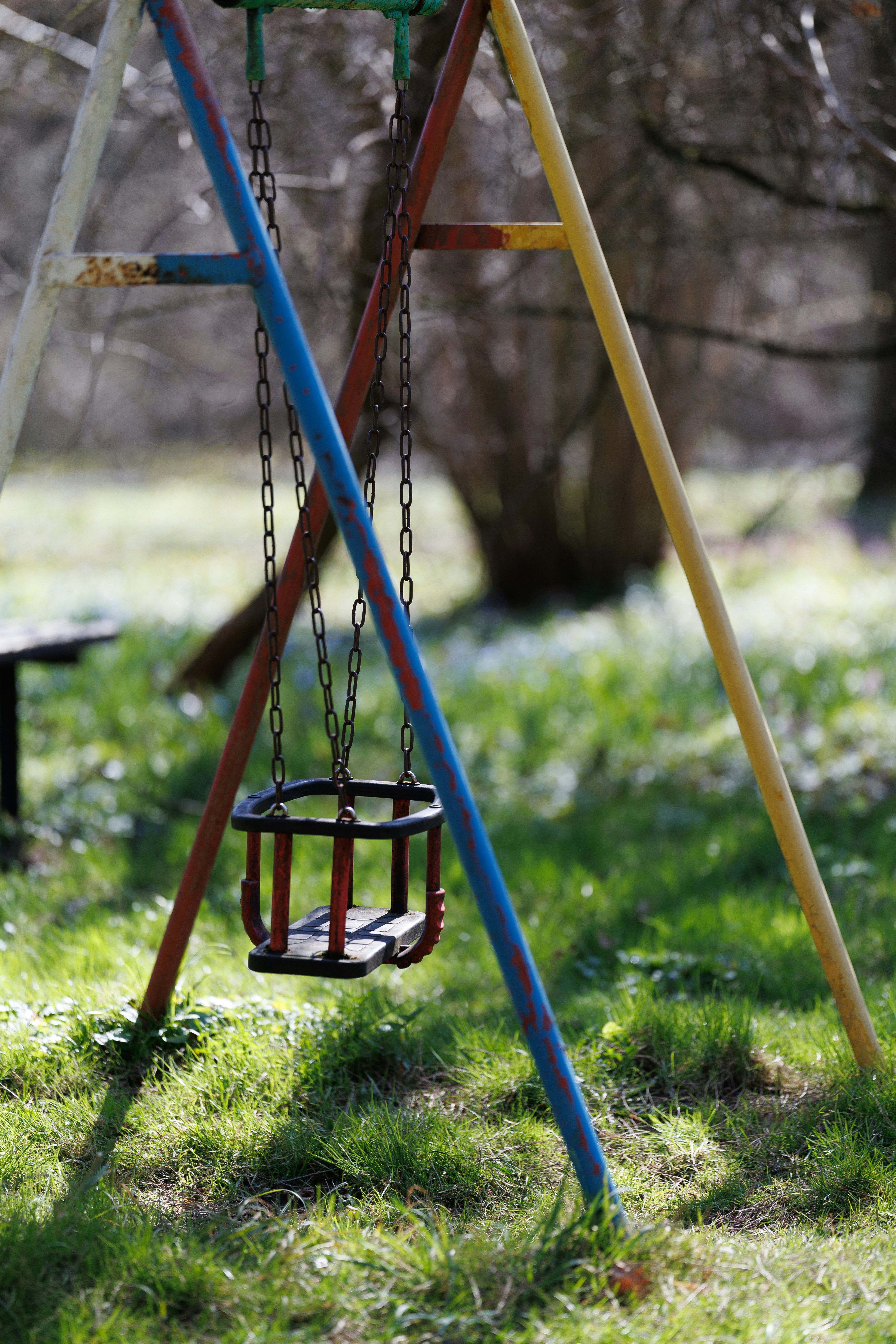 Sunlit Swing in a Quiet Park