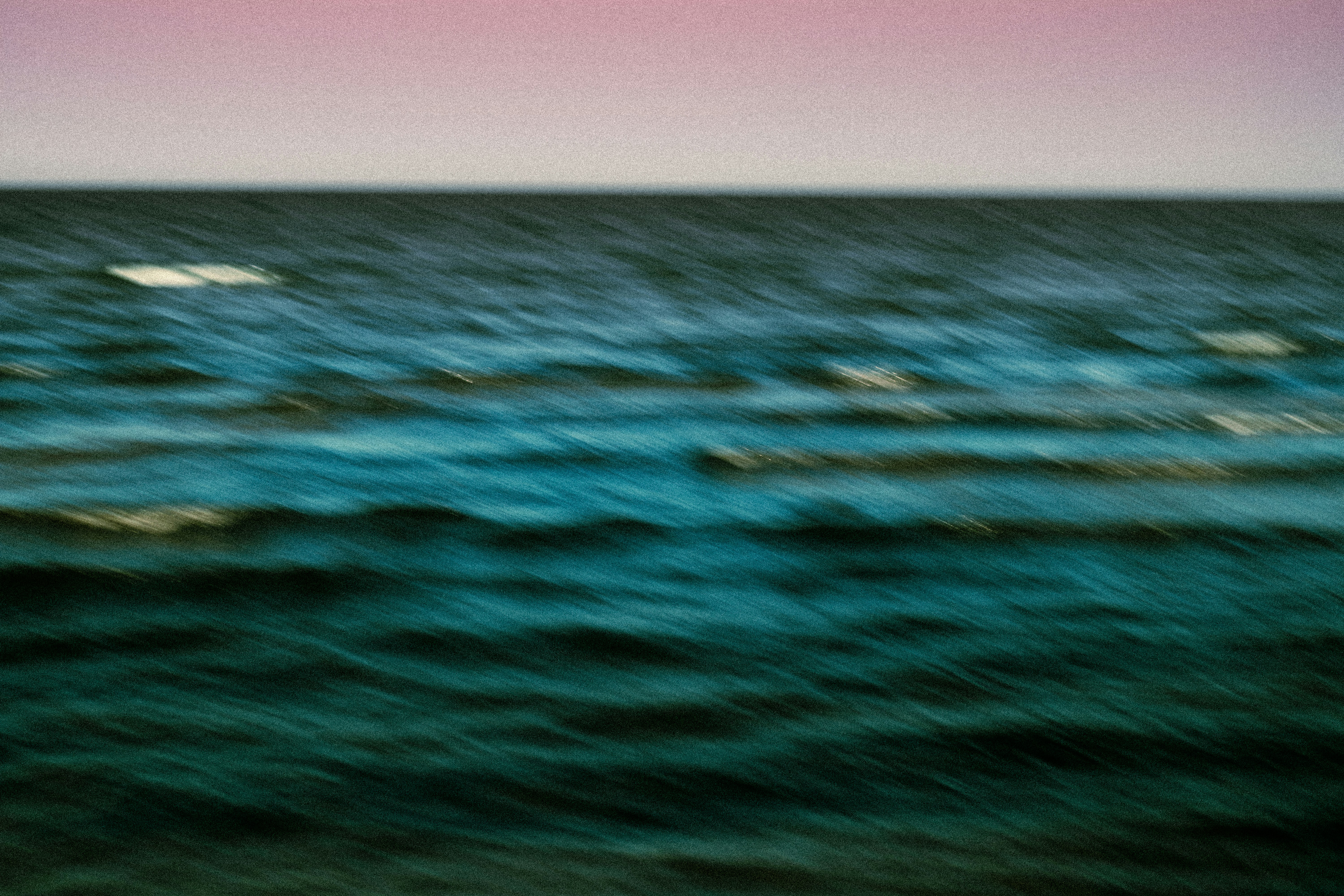 Blurred Horizon: Sea Tides in a Fiery Gloaming