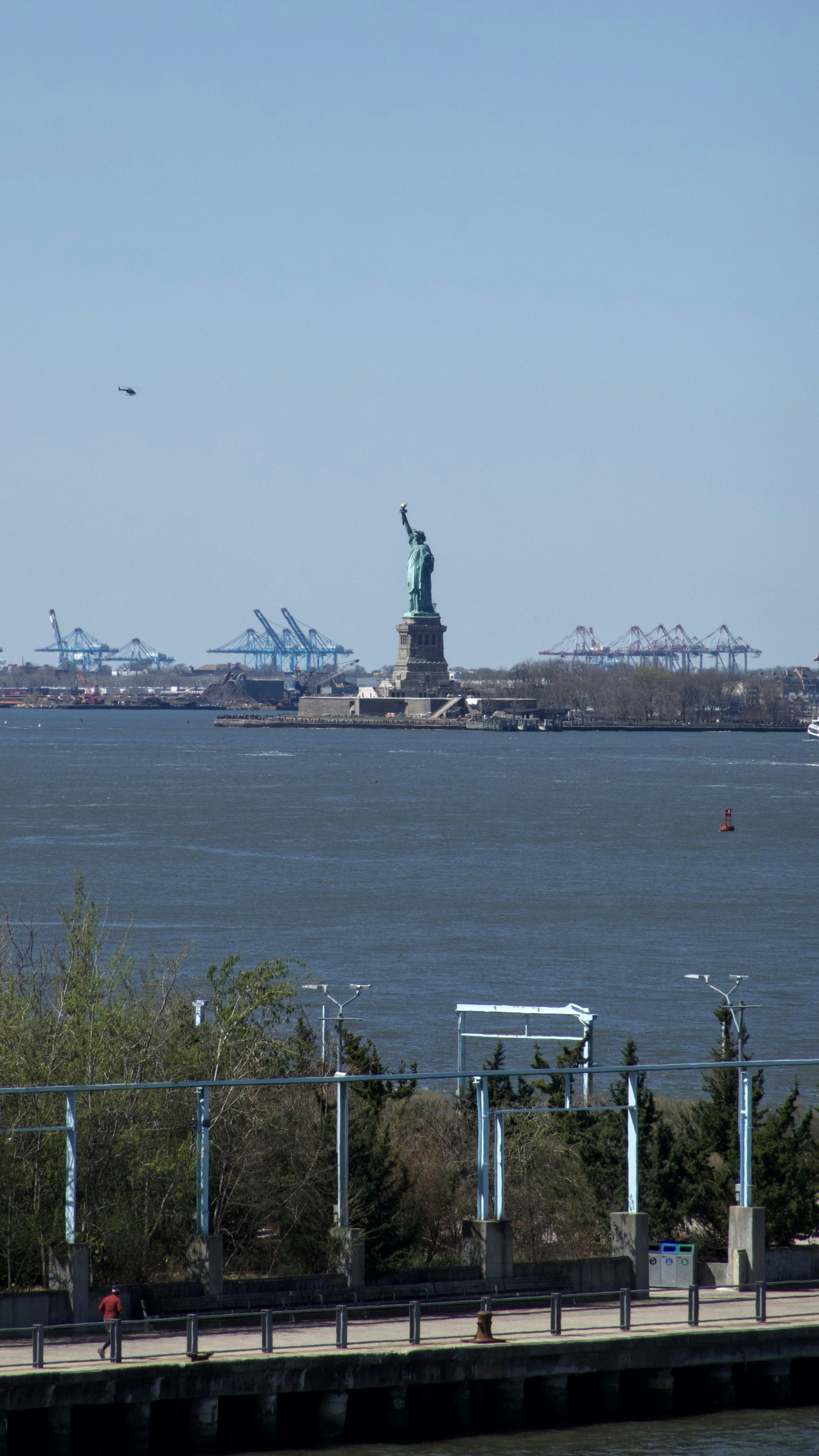 Liberty Amid the Distant Cranes: New York Harbor from the Waterfront