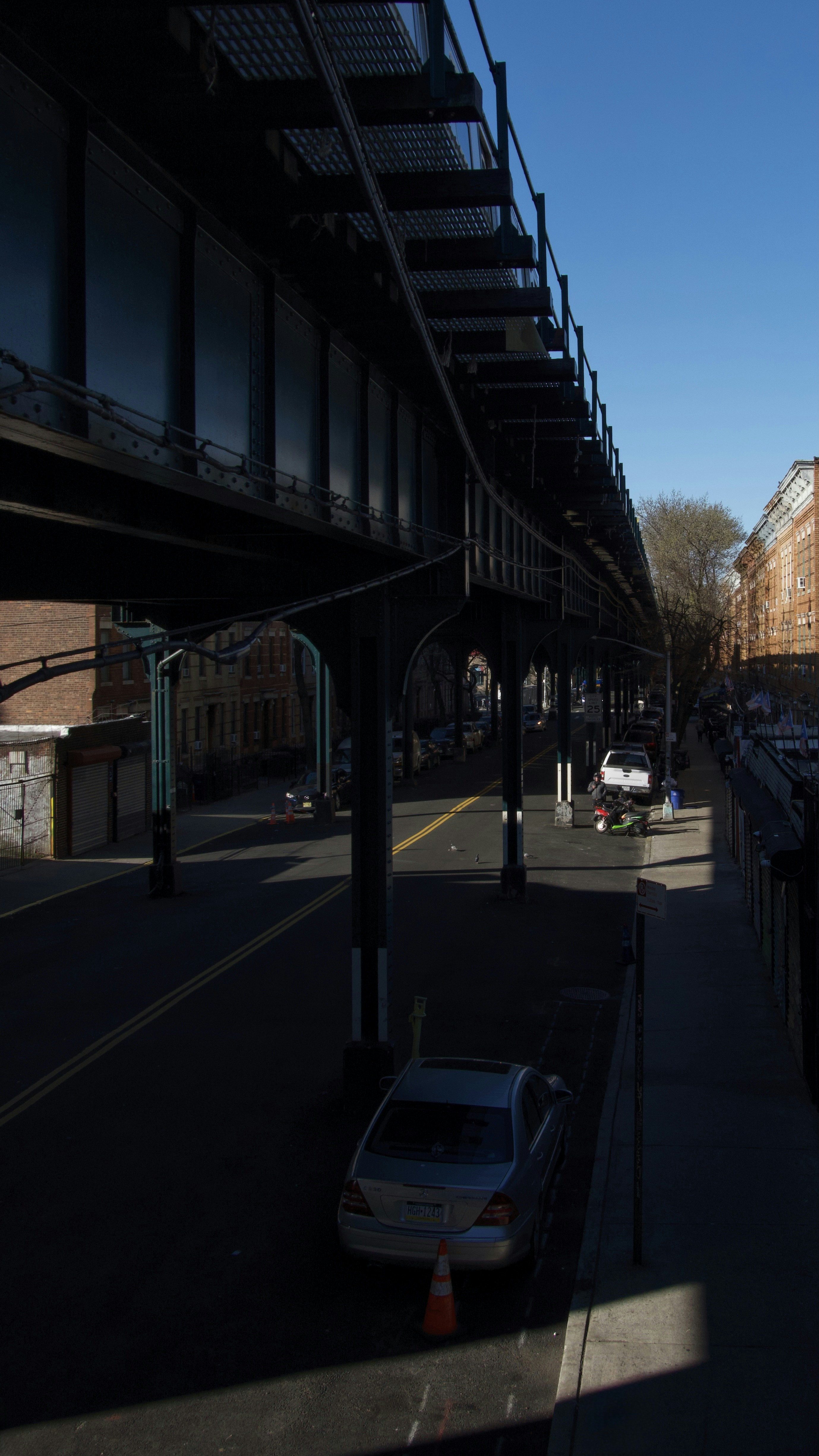Elevated Rails Over a Quiet City Street
