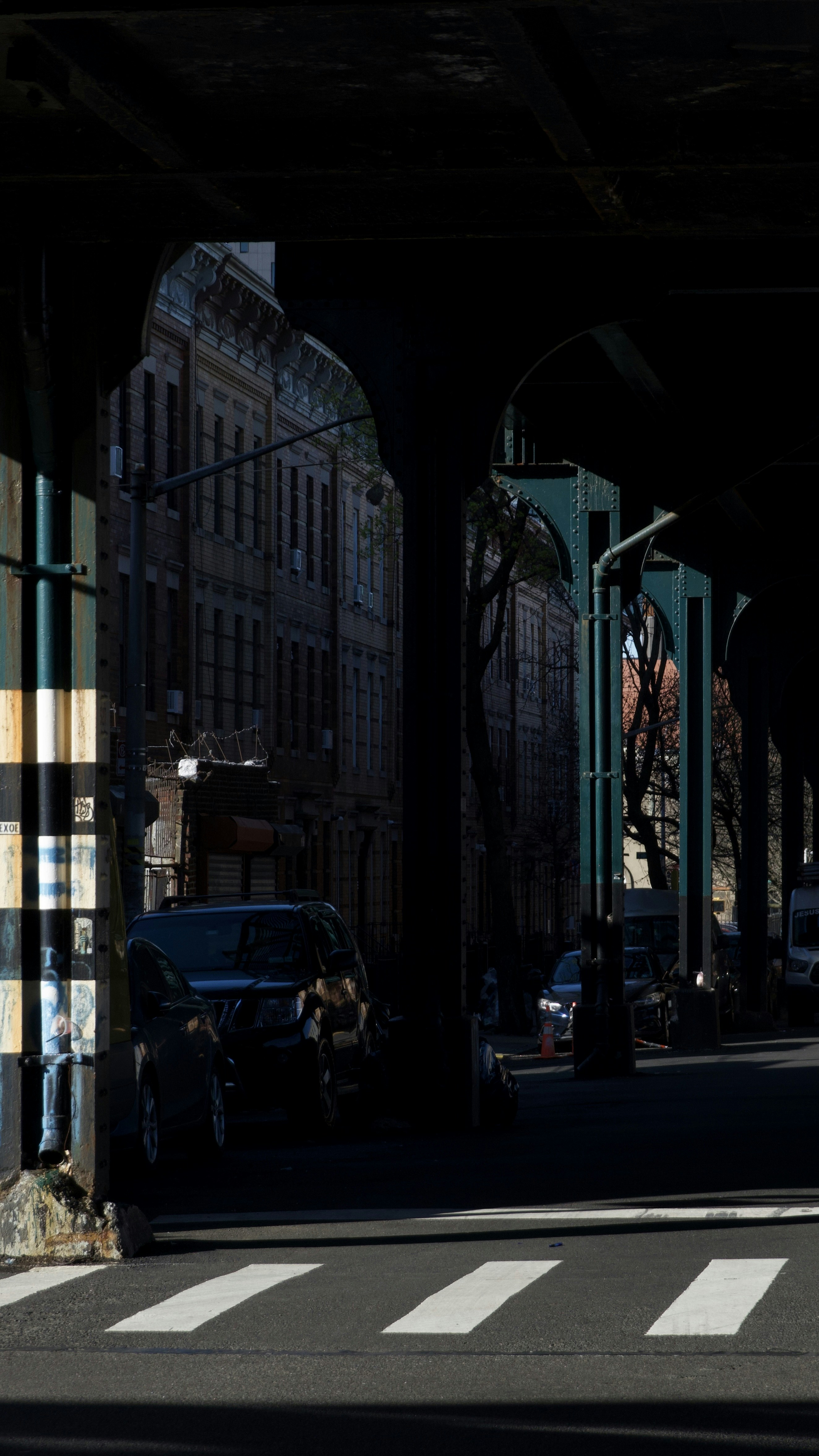 Under the City Arcades: A Quiet Street Slammed in Shade