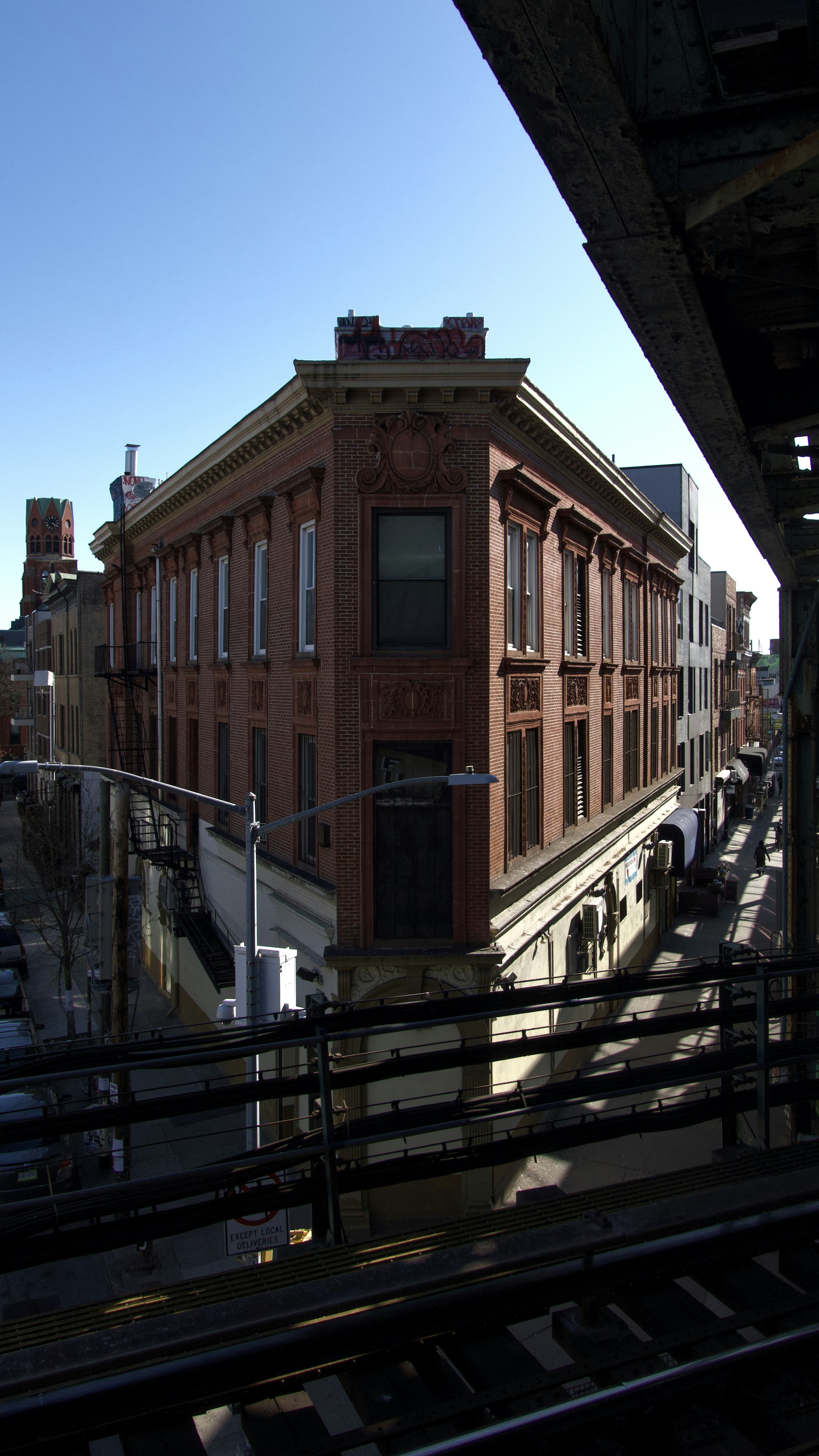 Brick Corner Opera: A Quiet Street Breached by Elevated Rails