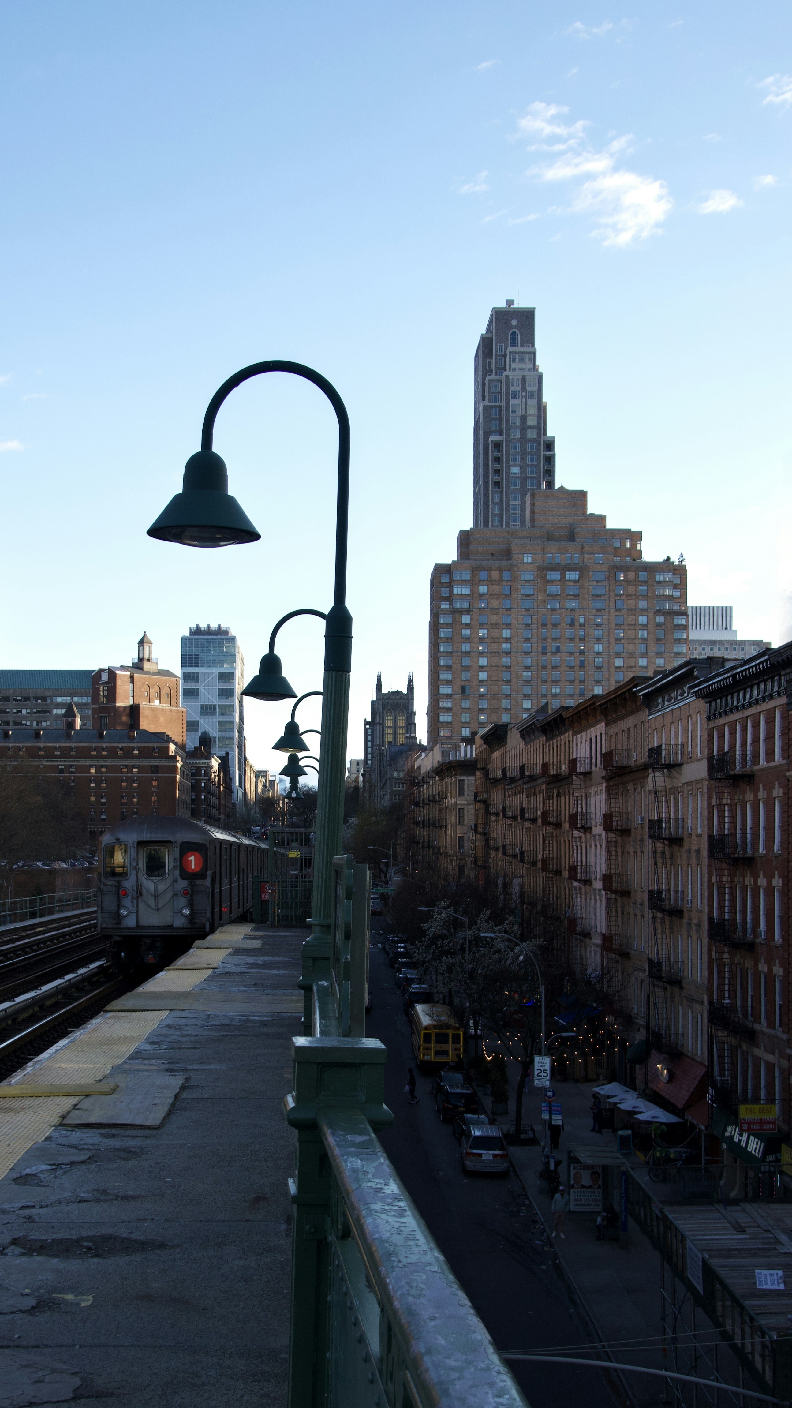 City Bridgeview: Streetlamps, Train, and Historic Row
