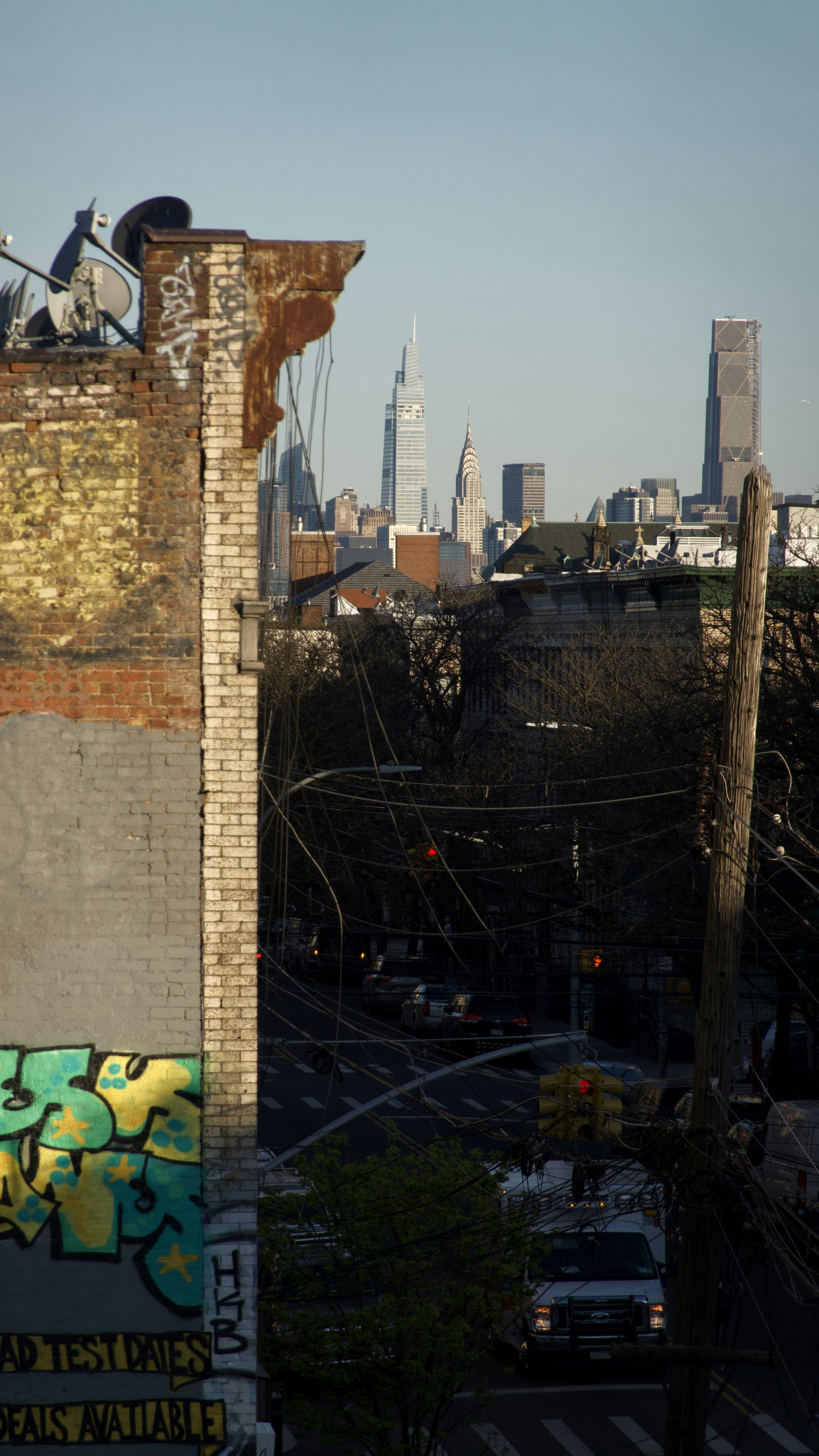 Rooftop Graffiti Framing the City Skyline