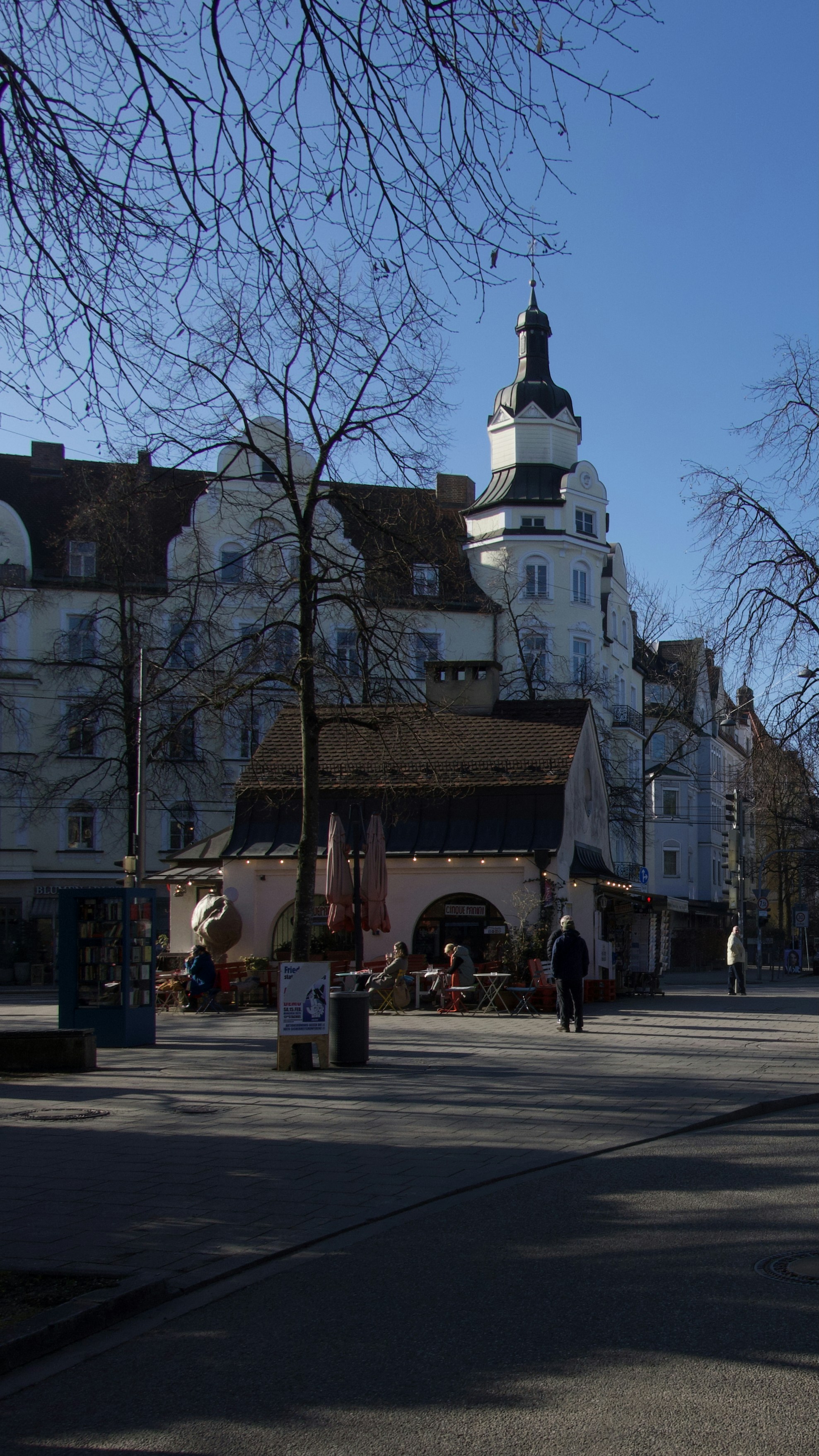 Café Corner in a European Avenue Under a Clear Blue Sky