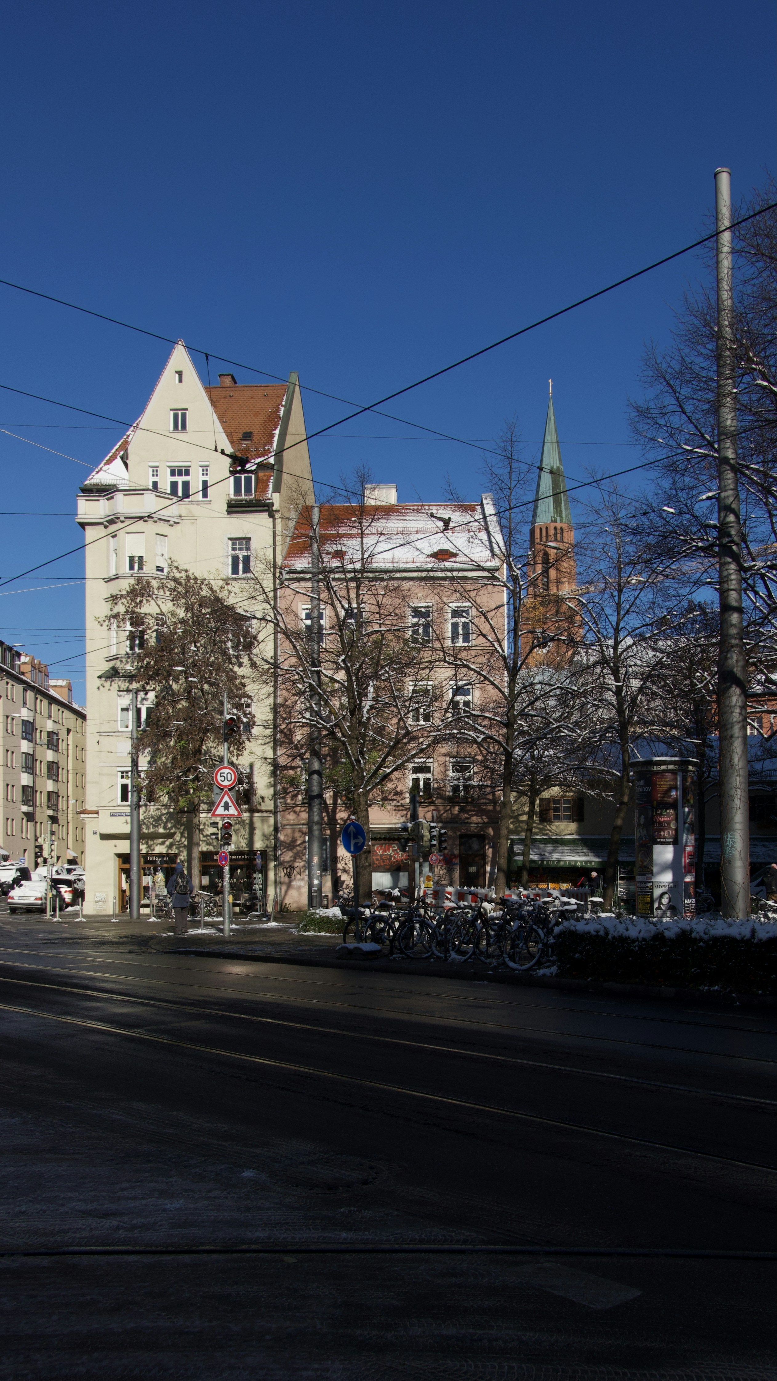 Blue Sky Over Urban Facades: A Winter Street Scene