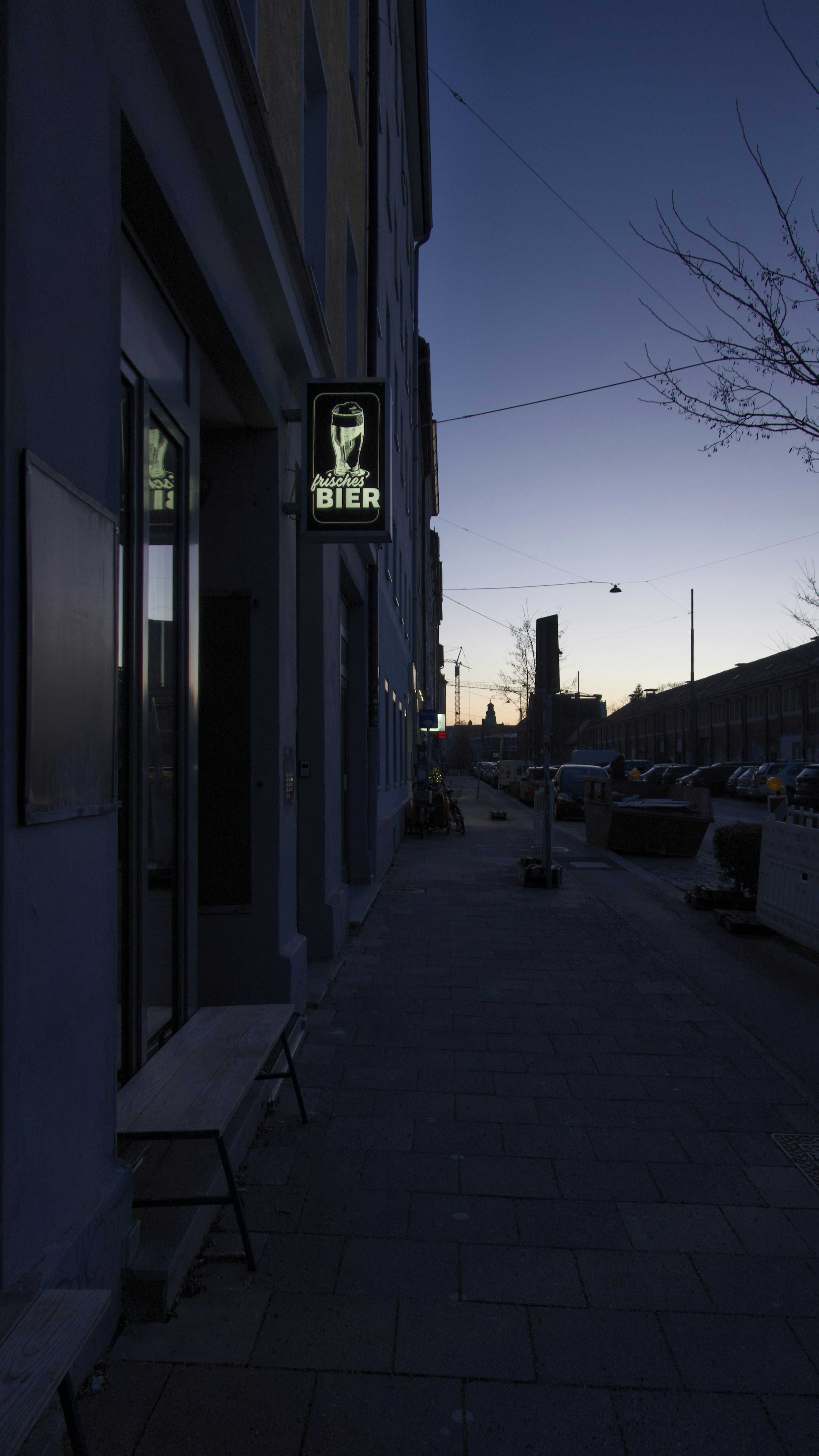 Evening Signpost: Quiet Street Leading to Sunset