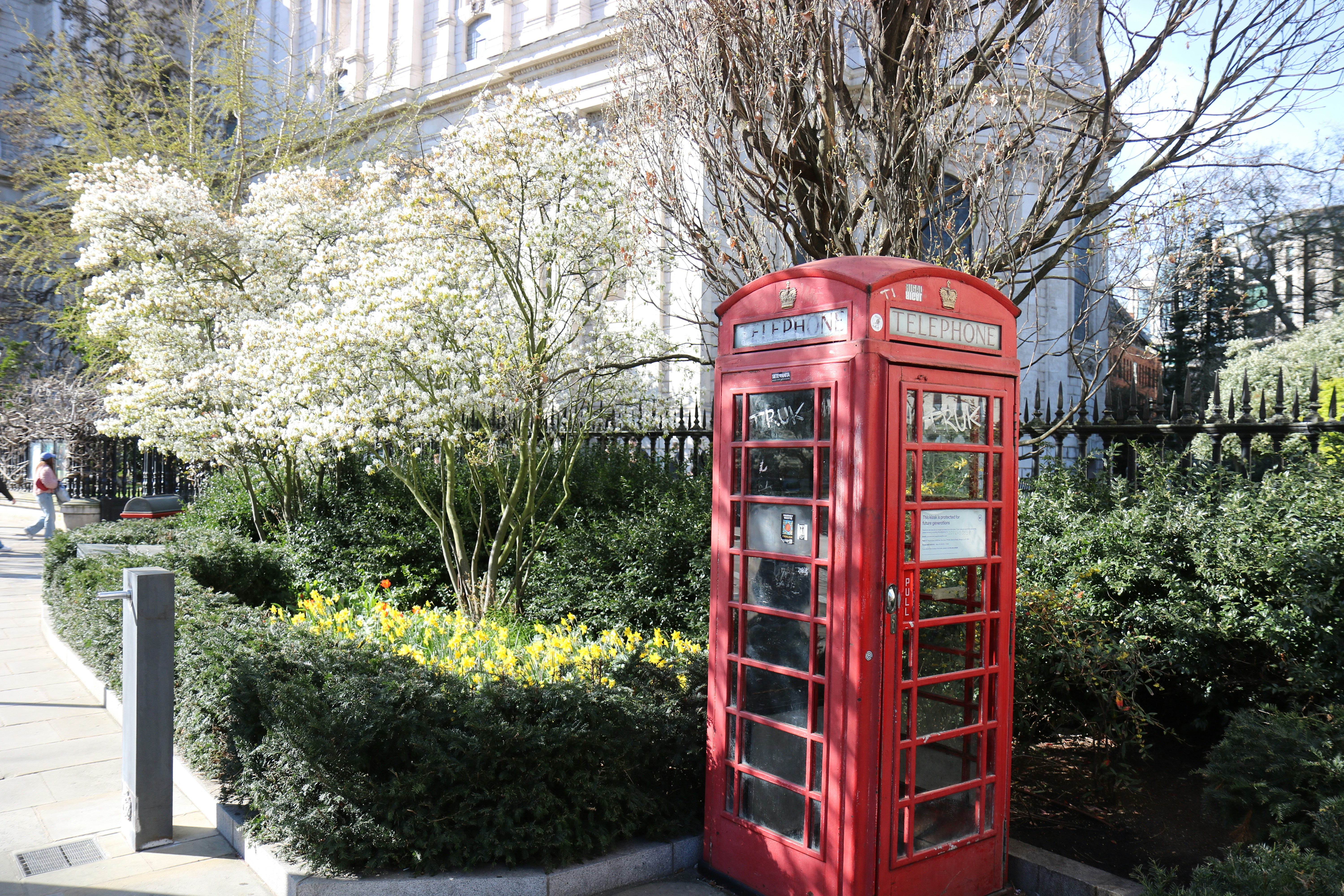 Red Kiosk in a Quiet City Garden