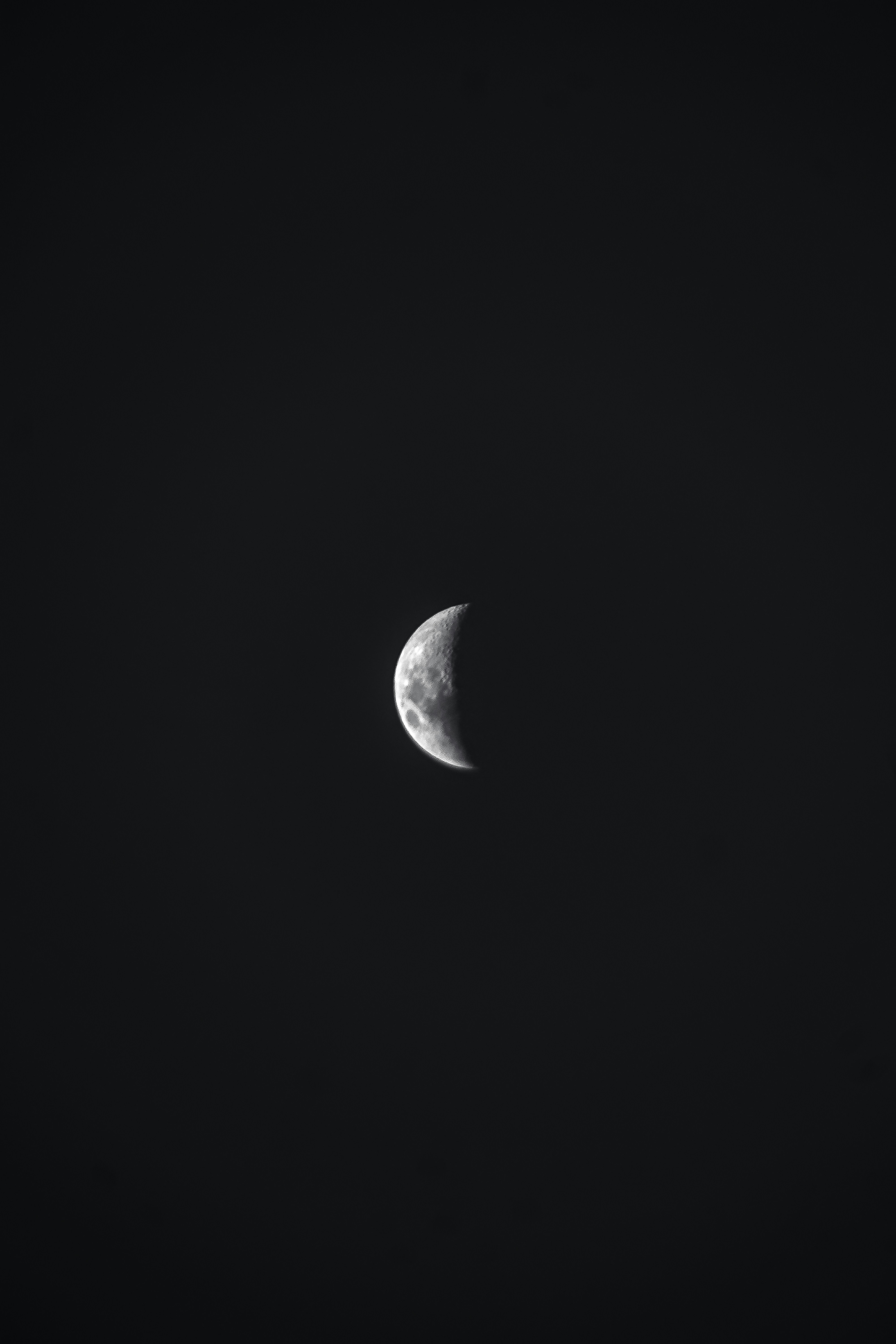Moonlit Crescent: A Quiet Sliver in the Night