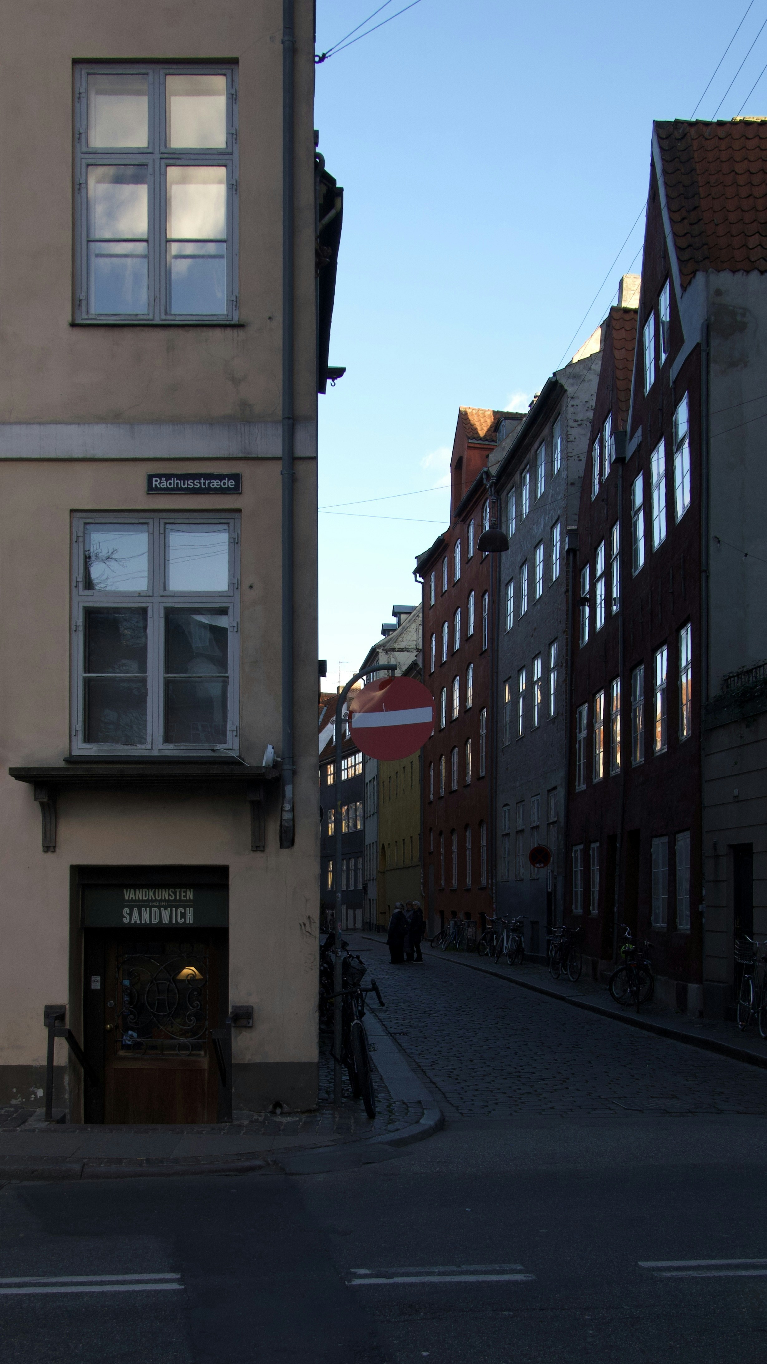 Cobbled Street Corridor Framed by Historic Facades
