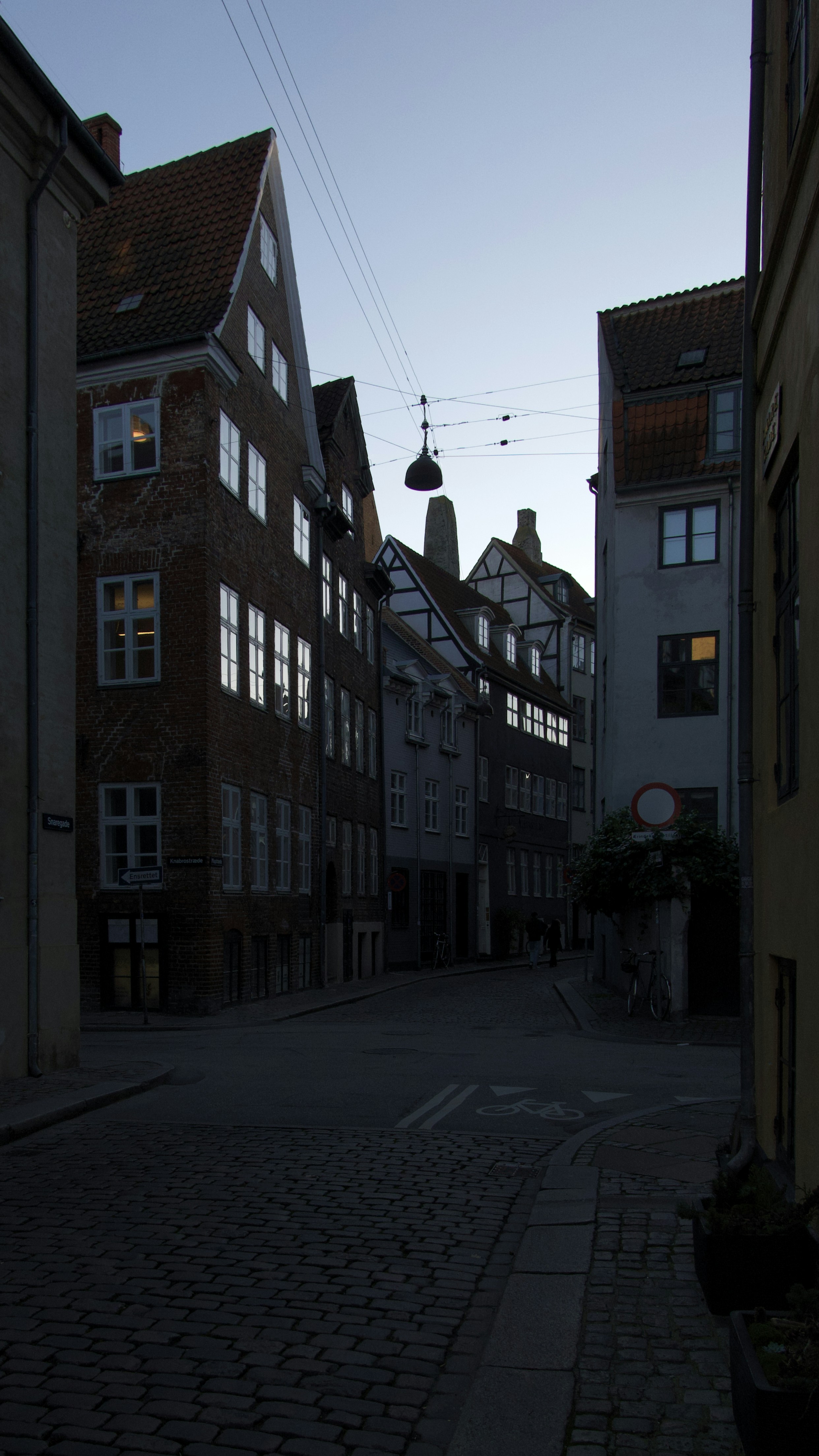 Cobbled Copenhagen Quiet: A Narrow Street Guides by Historic Facades
