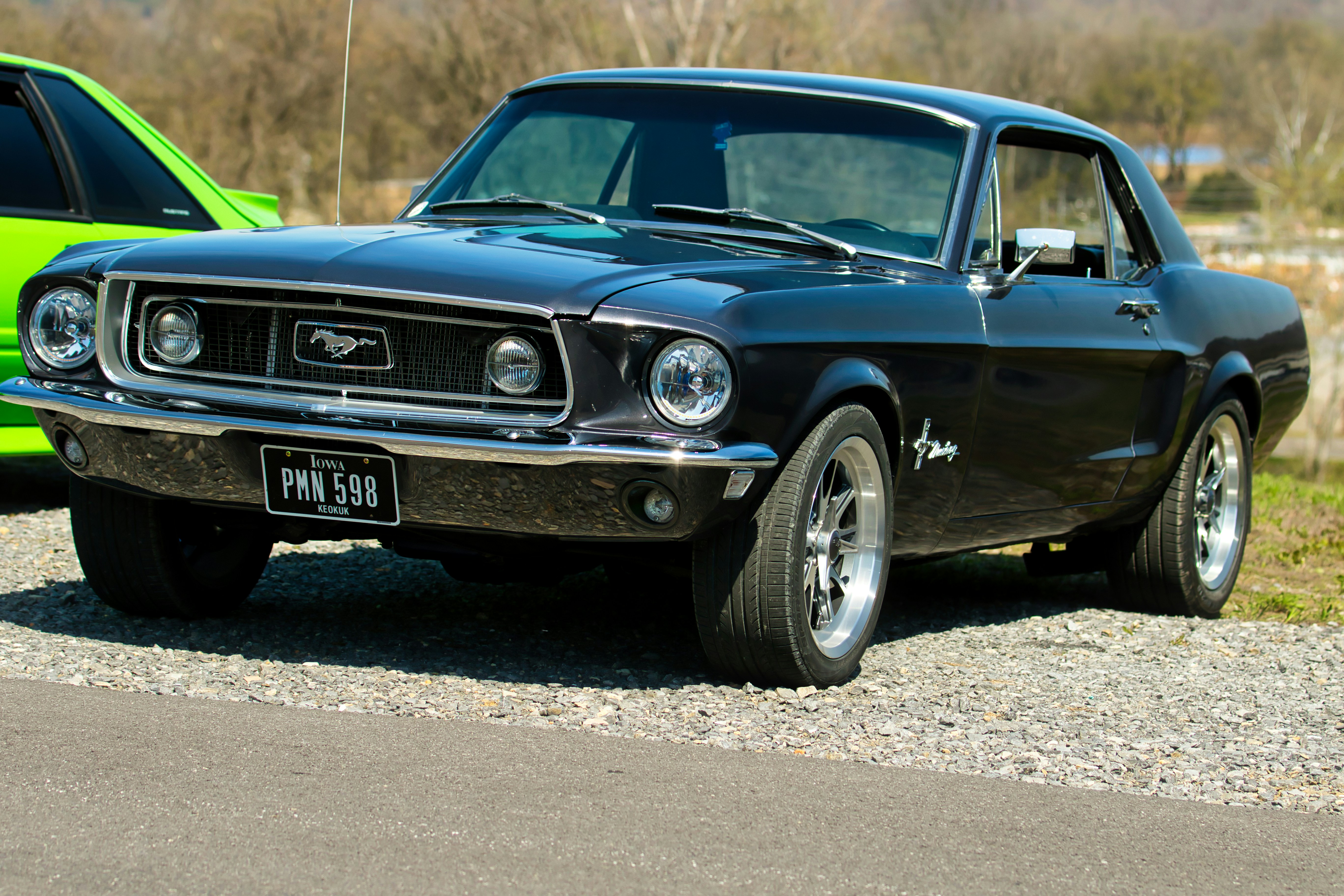 Midday Glint on a Classic Mustang: Chrome, Curves, and Power