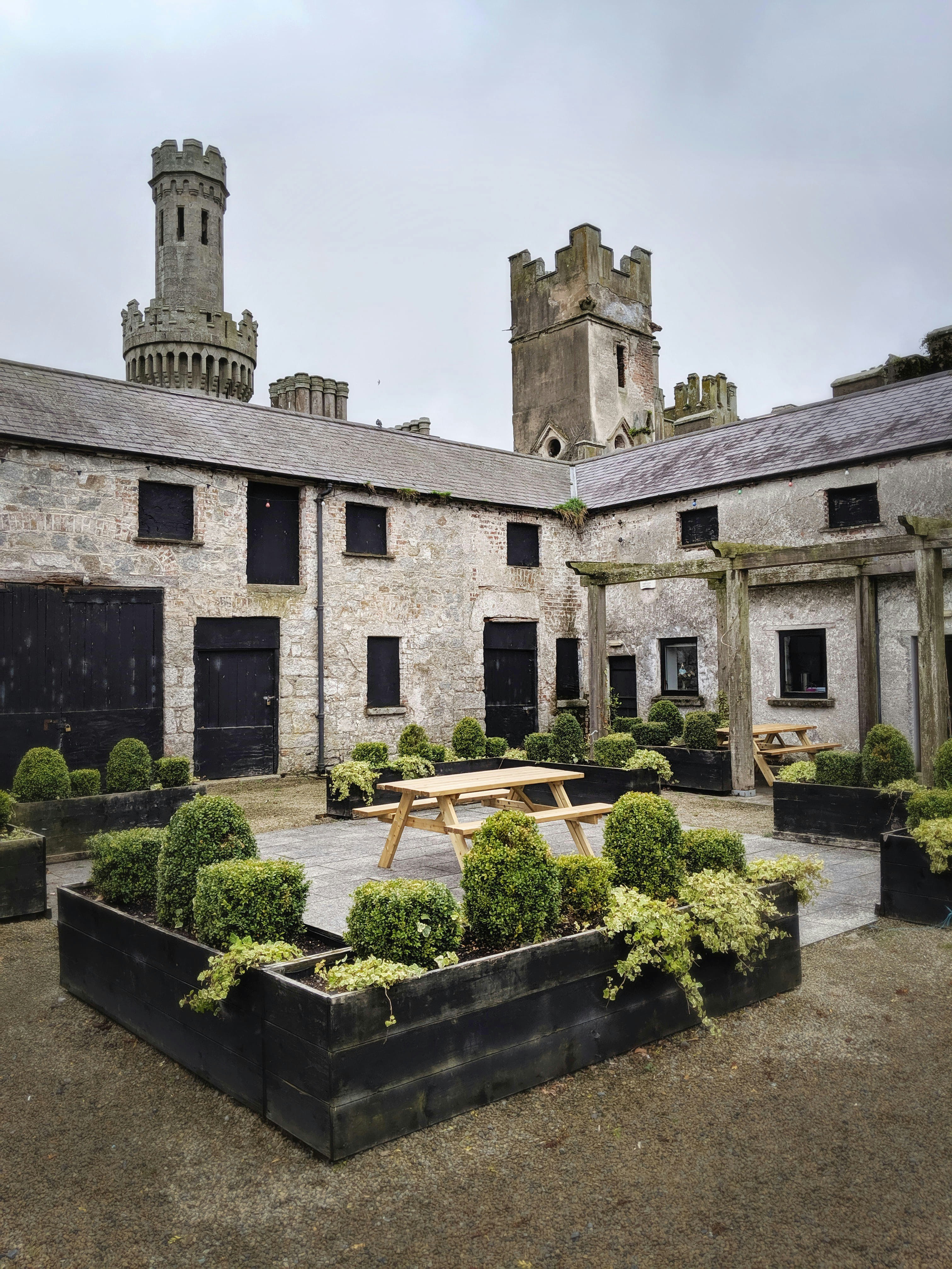 Courtyard of Castled Quiet: Symmetry and Greenery in Stone