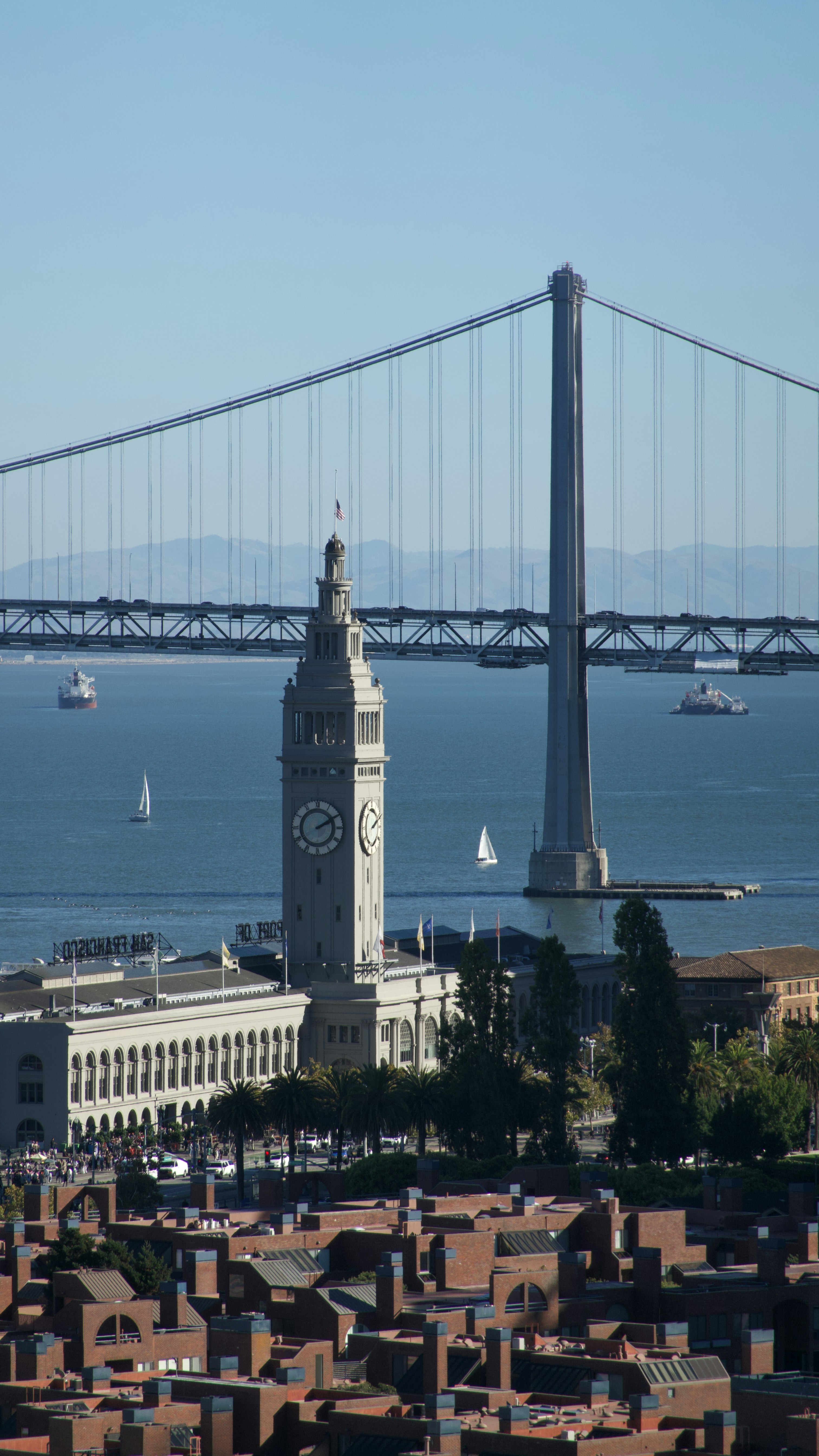 Clock Tower and Bridge Over the Bay