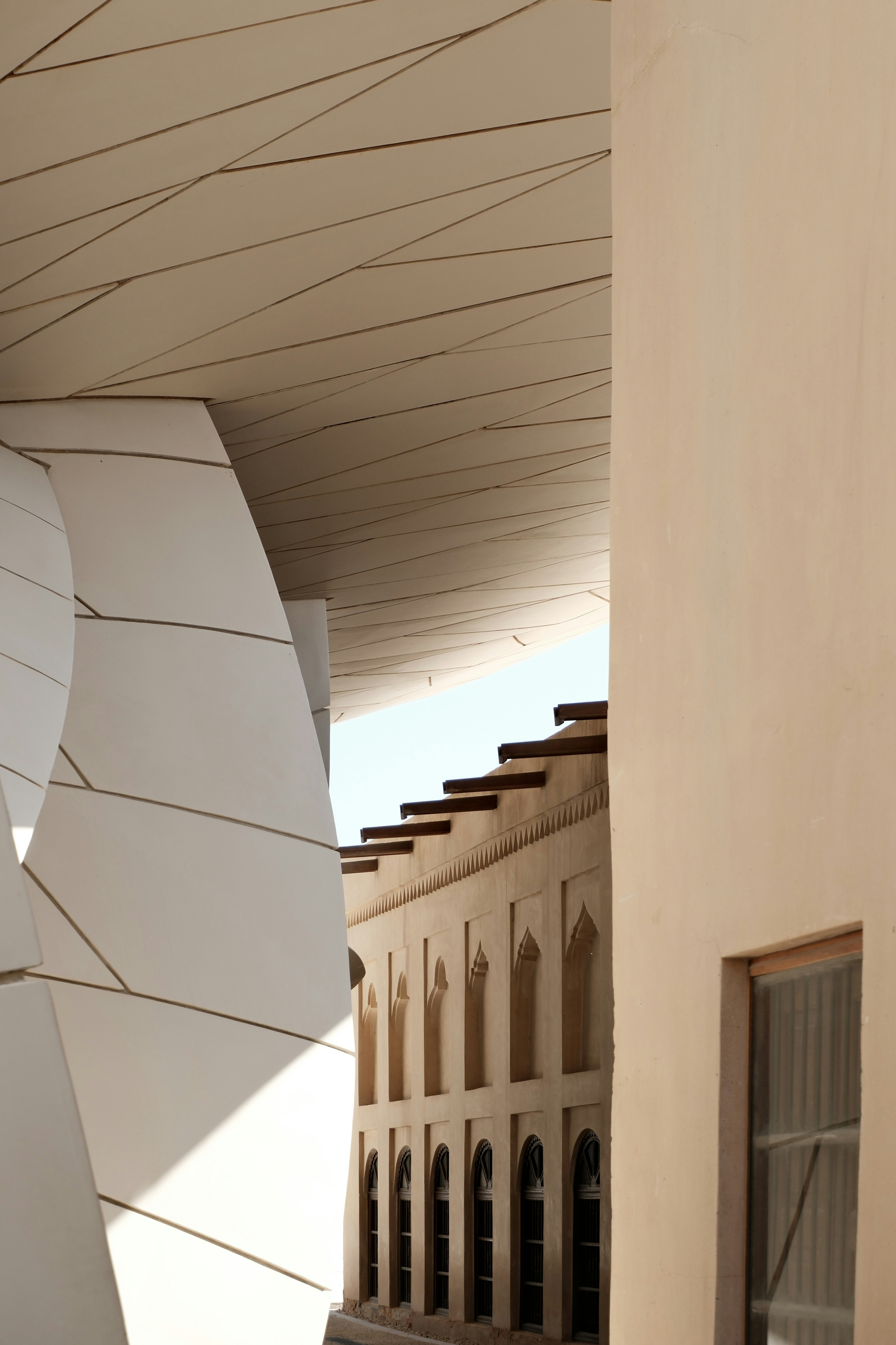Architectural Curve: Light and Shadow on Modern and Traditional Facades