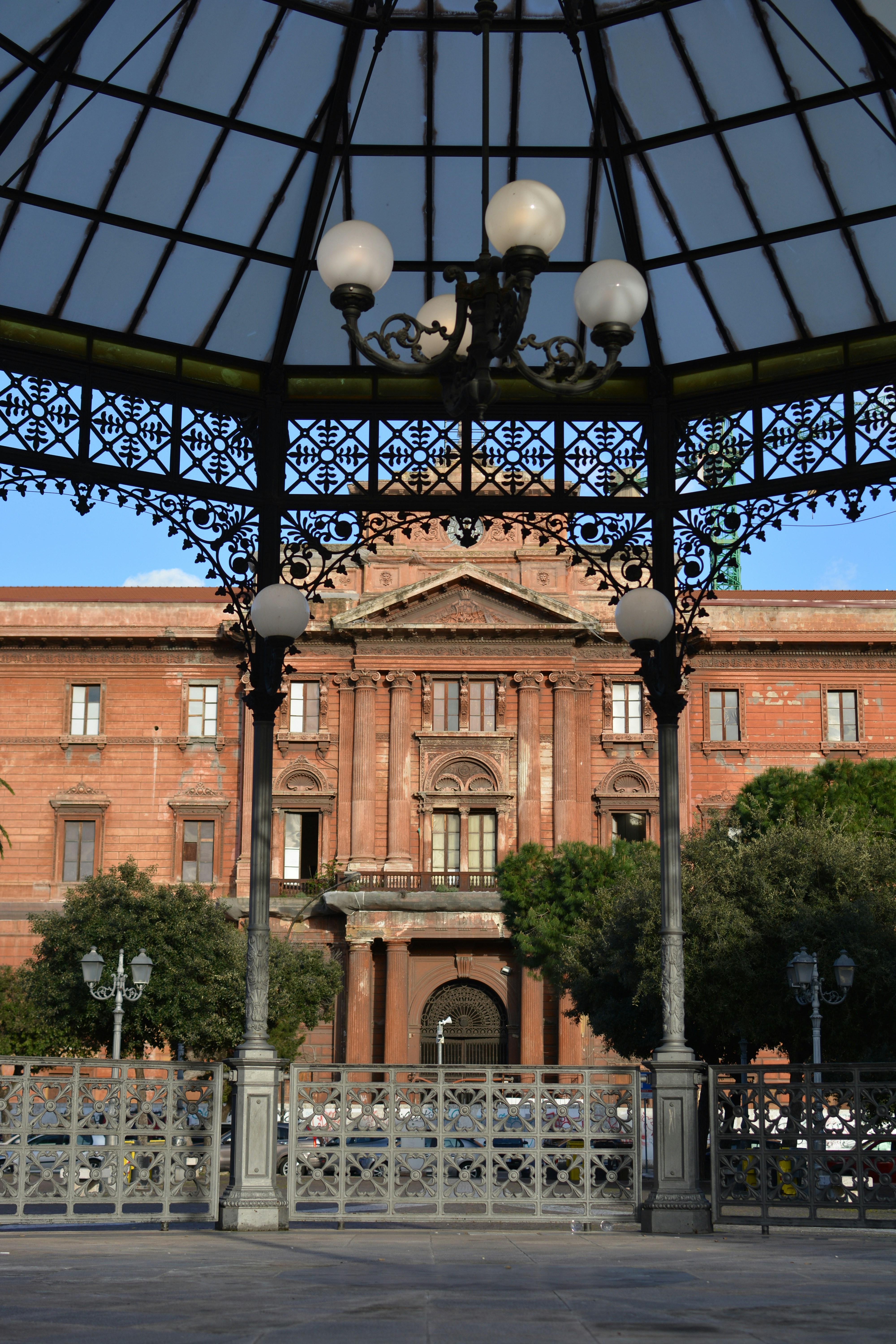 Ornate Pavilion Framing a Red Stone Facade